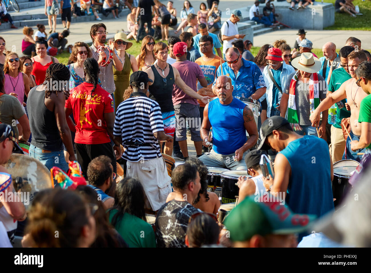 African American drummer and percussionists playing in front of the audience at Tam Tams ...