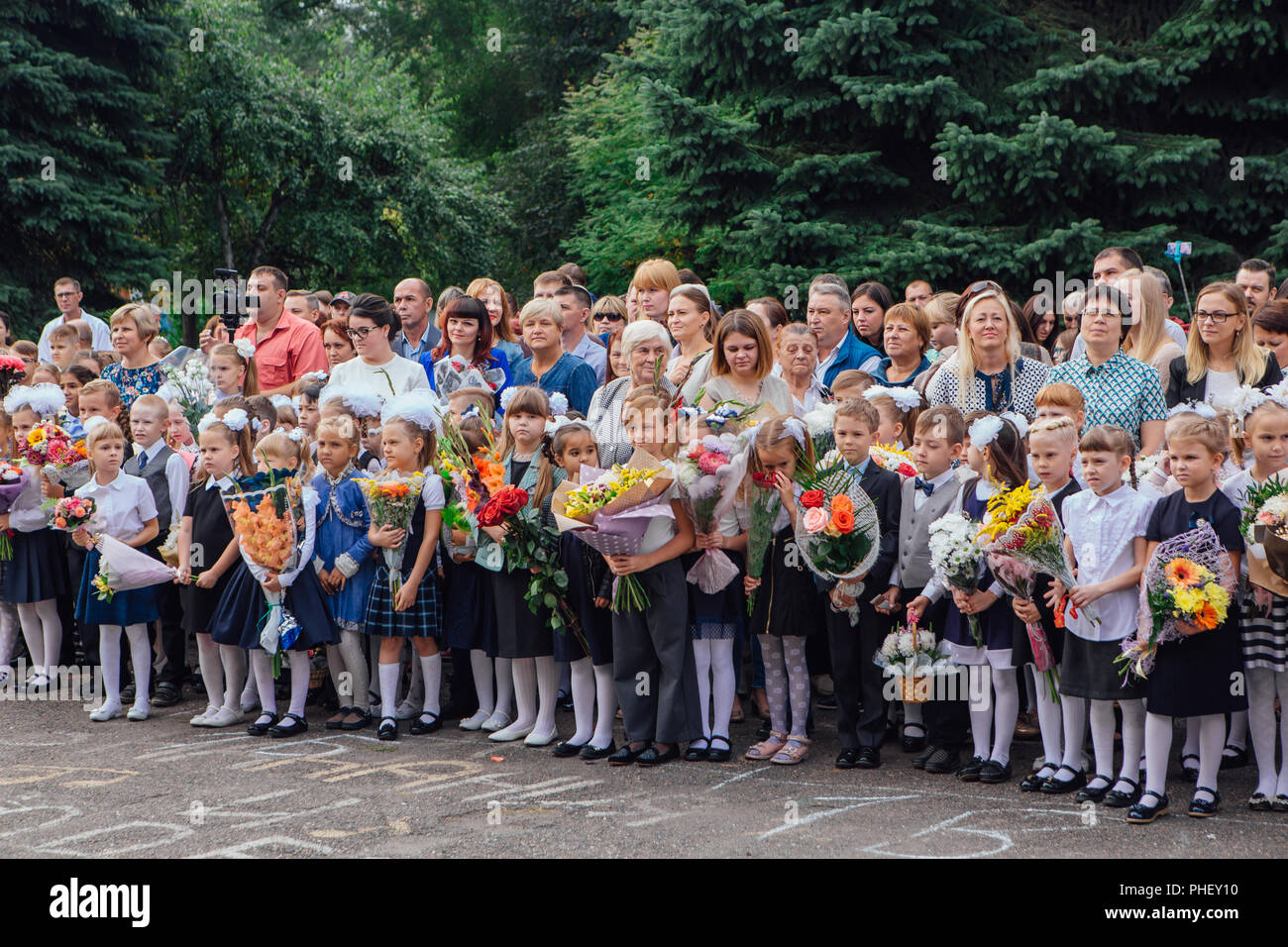 Happy teacher meeting parents hi-res stock photography and images - Alamy
