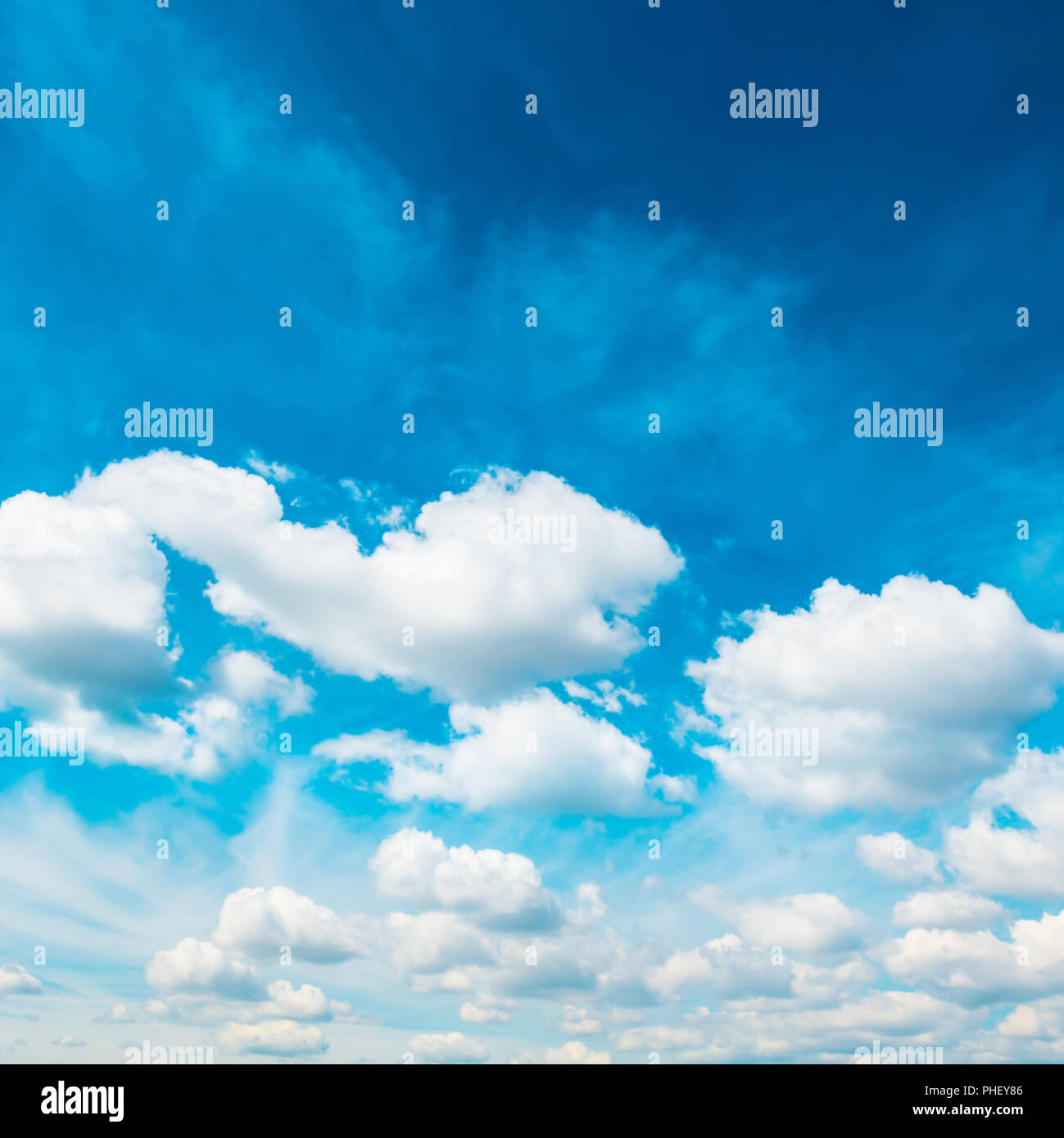 Clear blue sky with fluffy white clouds hi-res stock photography and ...