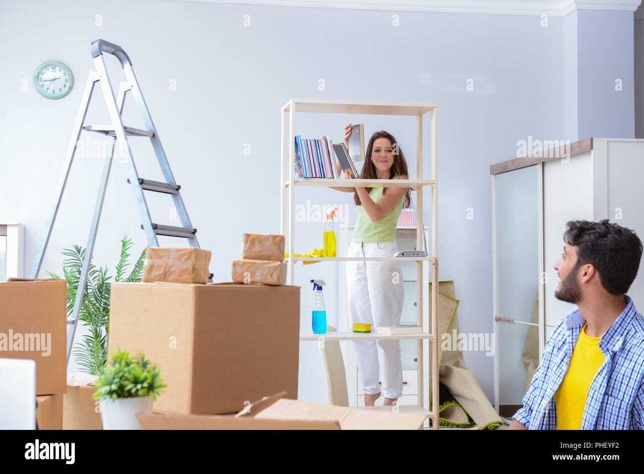 Young family unpacking at new house with boxes Stock Photo - Alamy