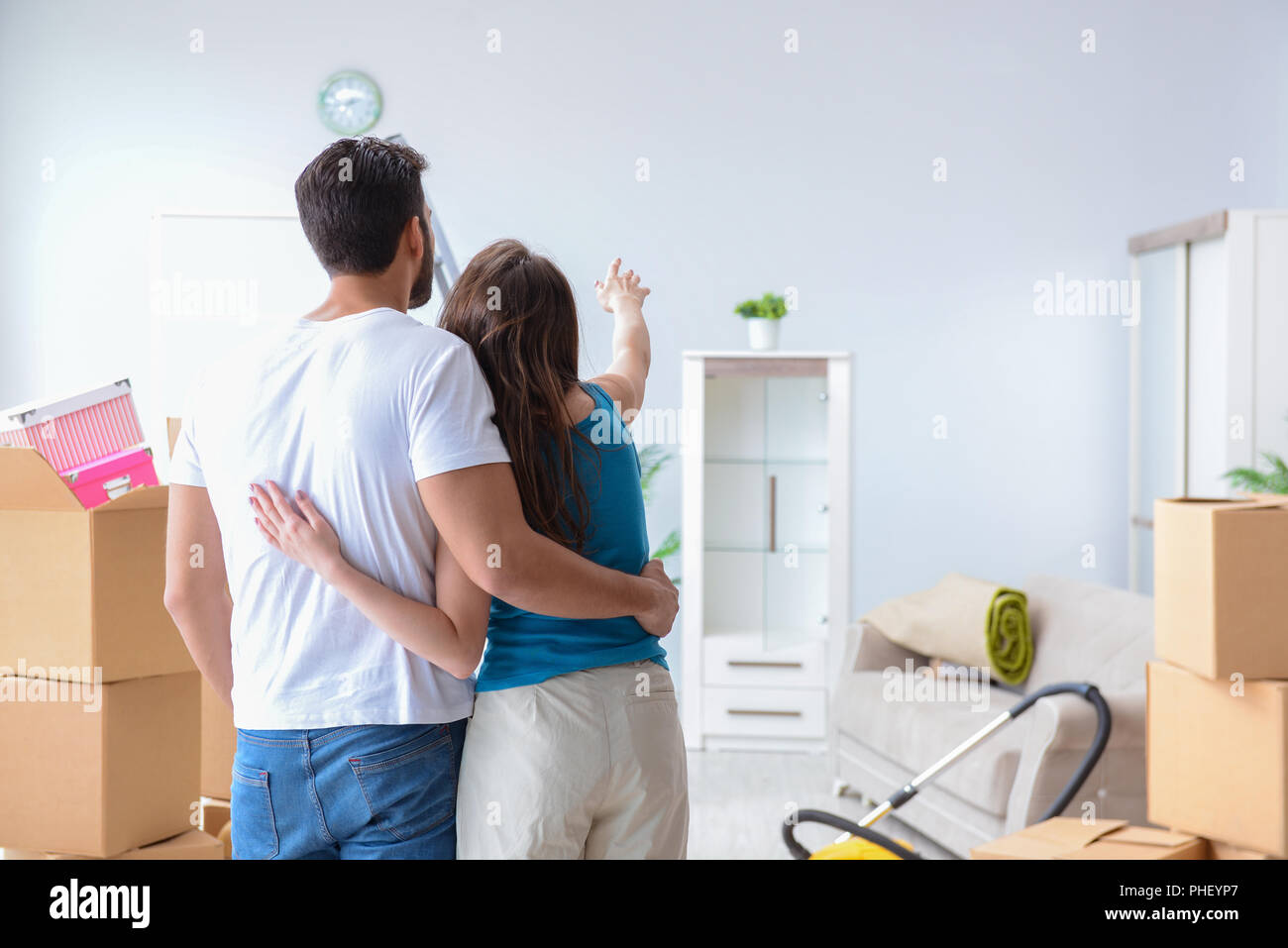 Young family unpacking at new house with boxes Stock Photo - Alamy
