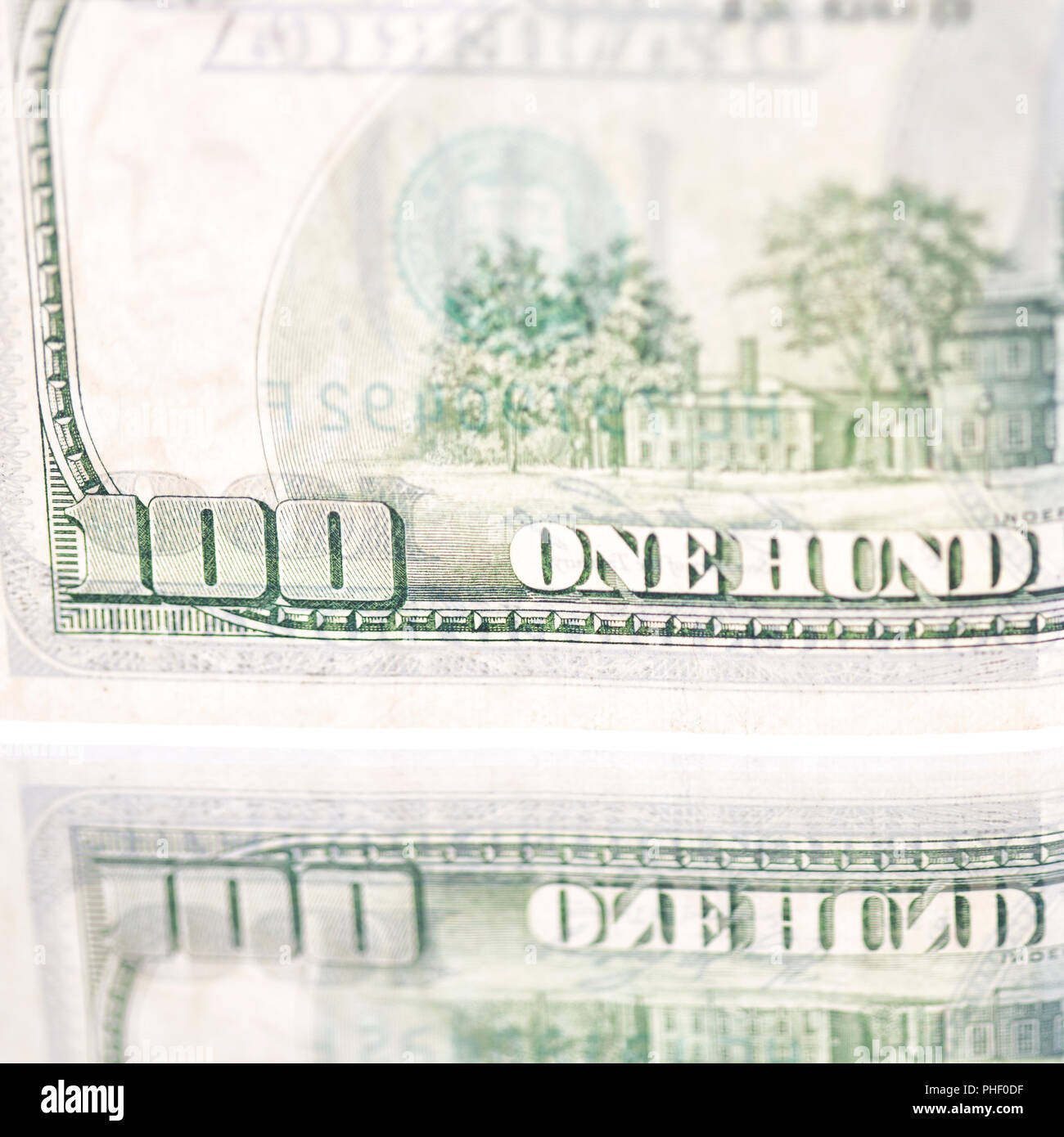 blurred dollar money background and mirror like concept of success ...
