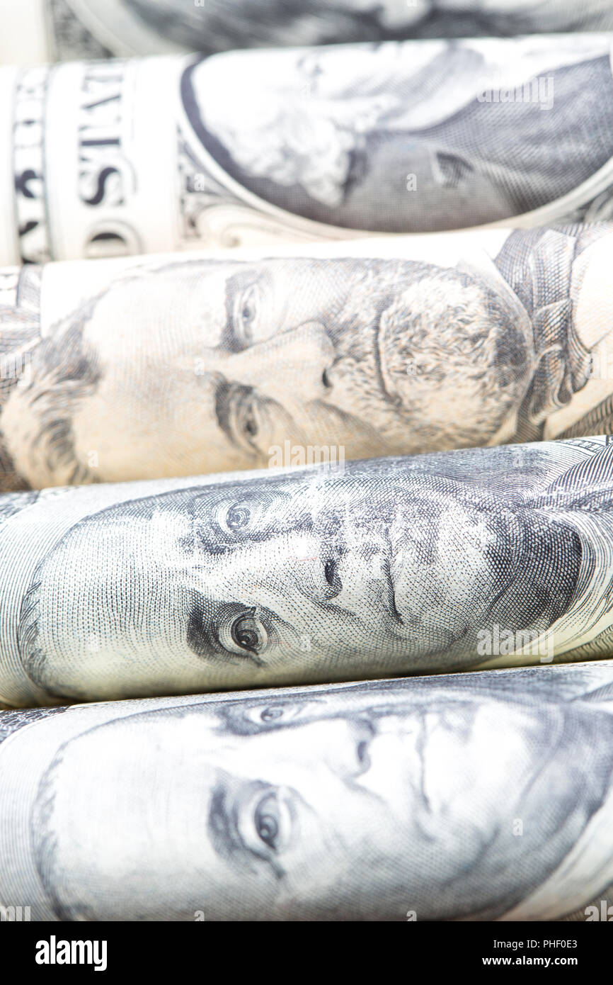blurred dollars banknote rolled up and close up concept of economy ...
