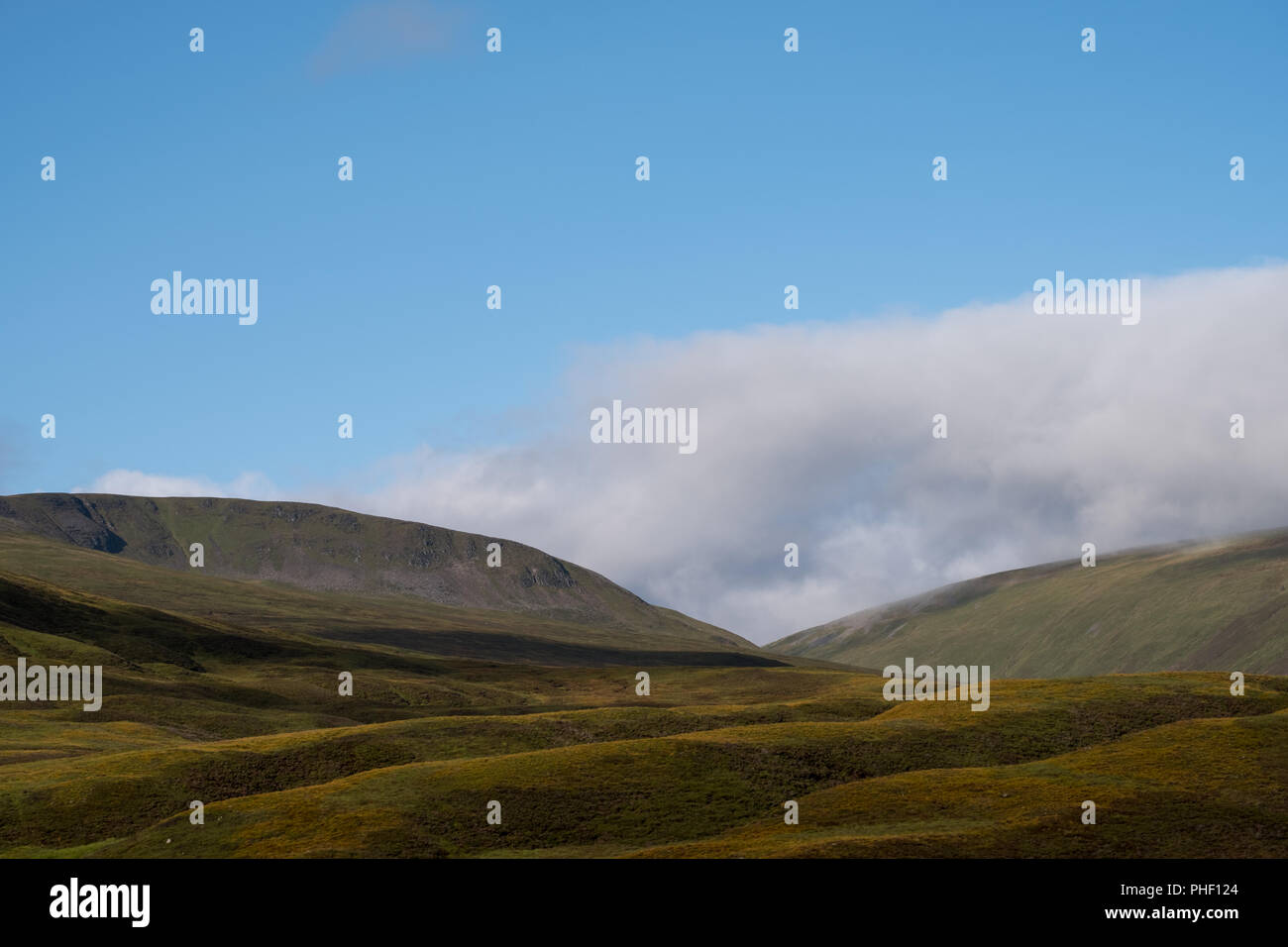 Hills in Scottish Highlands on a clear summer's day, with low lying ...