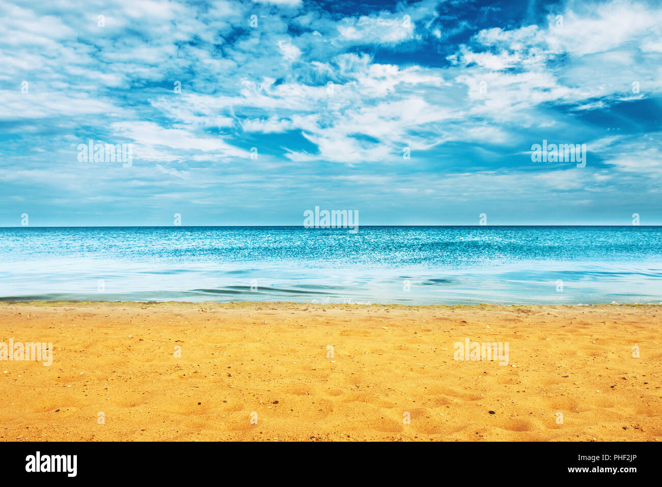 Beautiful summer sea and golden sand beach Stock Photo - Alamy