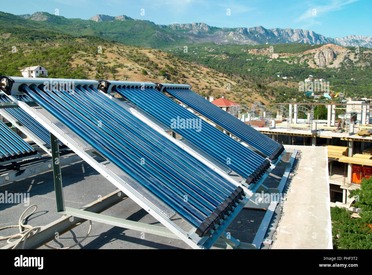 Vacuum solar cells for water heating system Stock Photo - Alamy