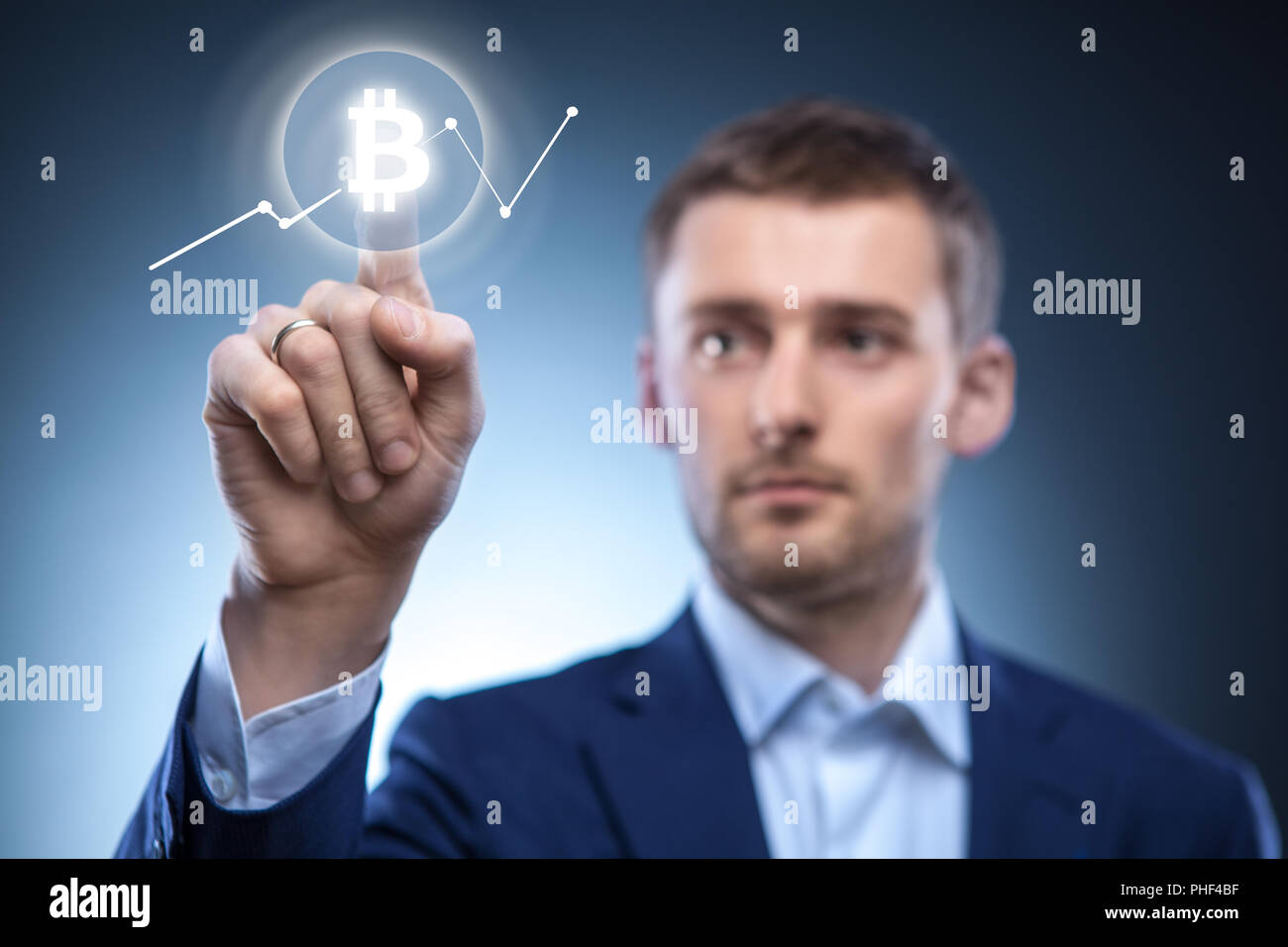 hand man Icon Bitcoin on virtual screen Stock Photo - Alamy