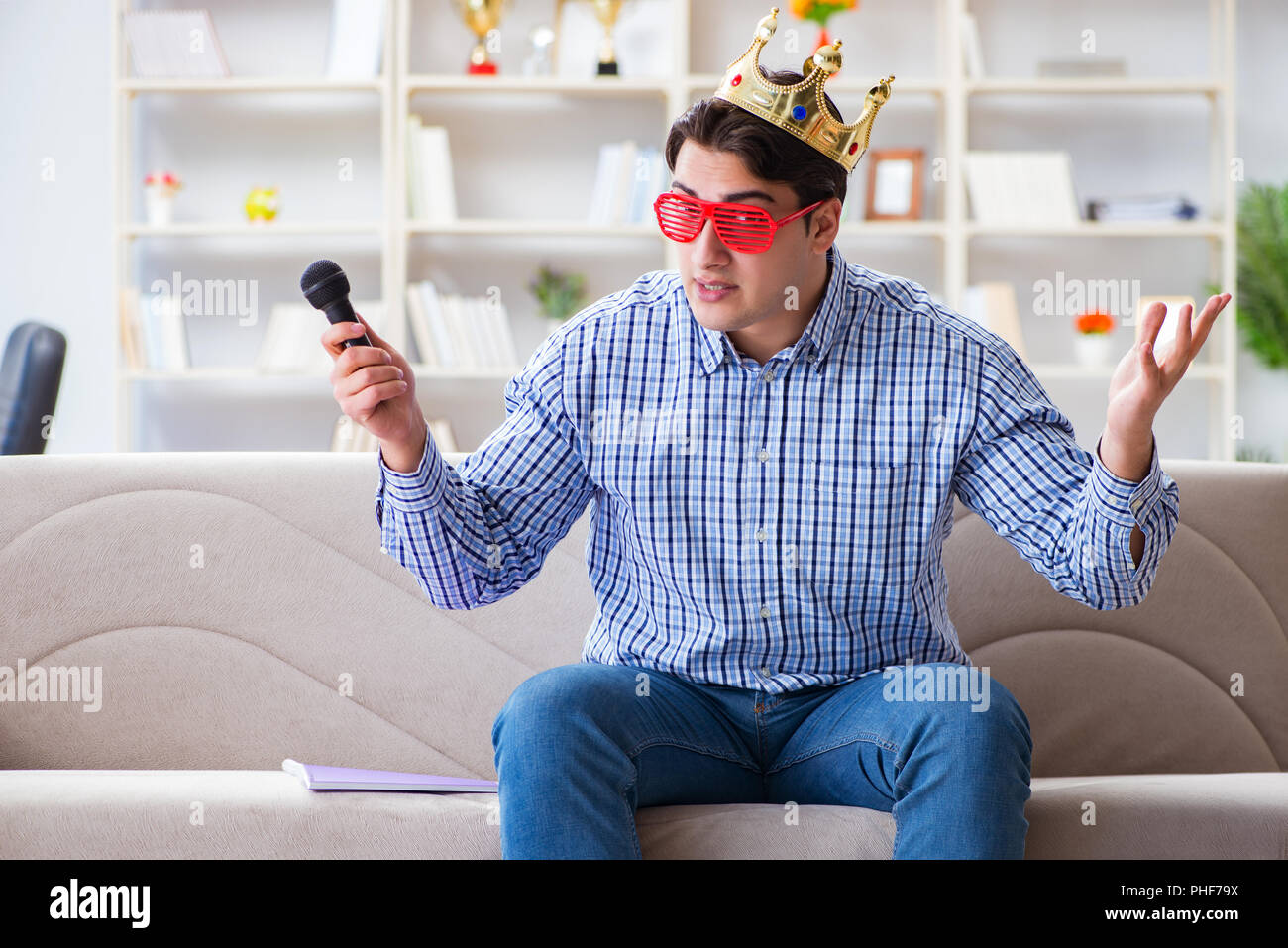 Funny man singing songs in karaoke at home Stock Photo - Alamy