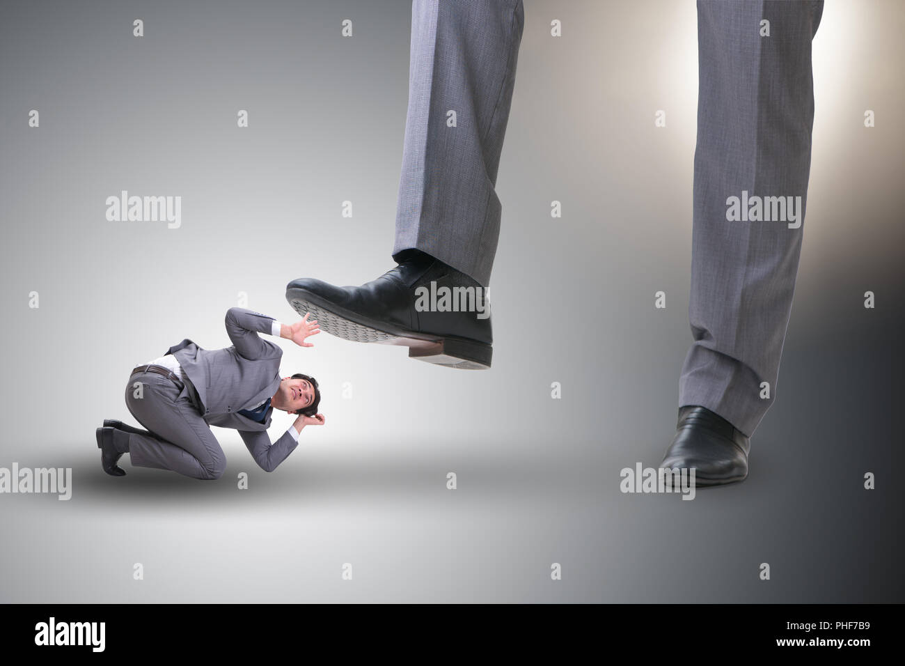 Bad angry boss stamping on employee in business concept Stock Photo - Alamy