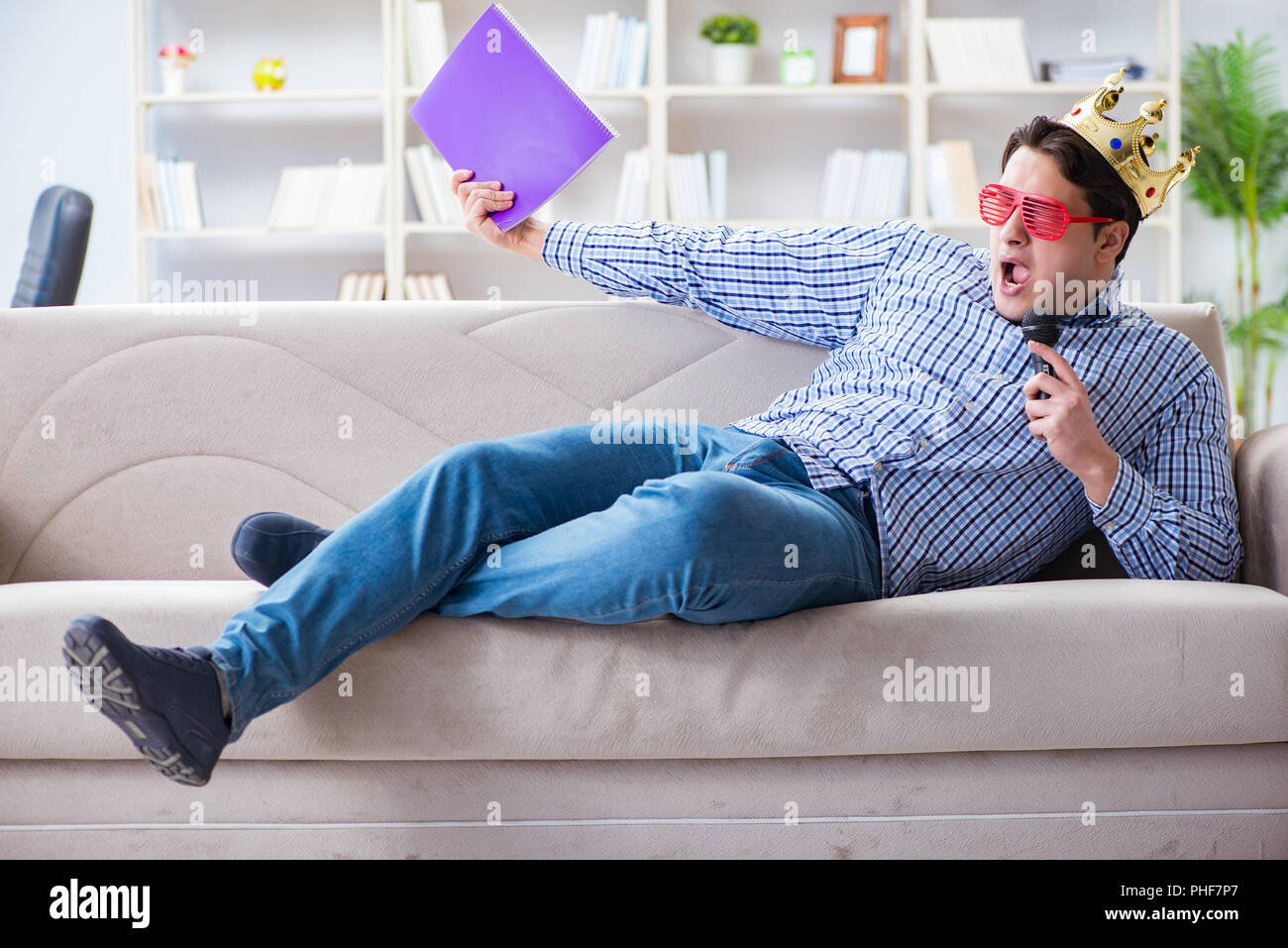 Funny man singing songs in karaoke at home Stock Photo - Alamy
