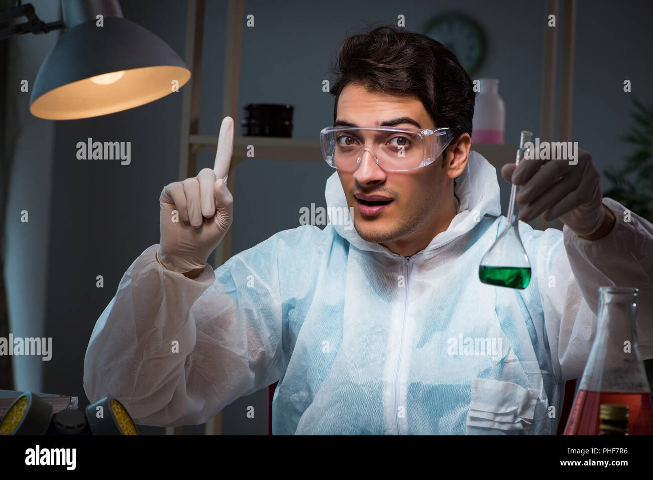 Young male lab chemist late at night in overtime time Stock Photo - Alamy