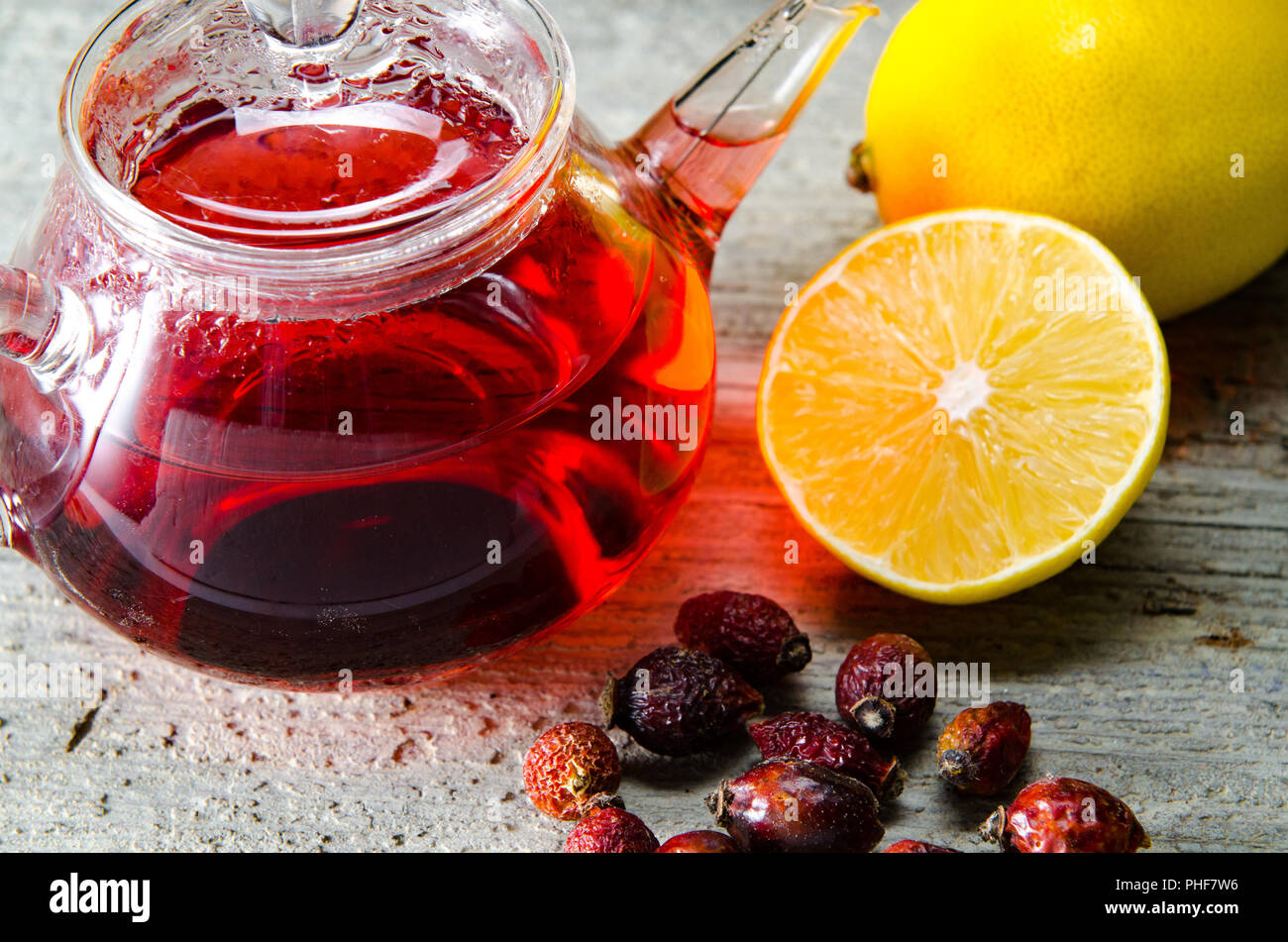 Fruit berry tea in the cup served on table Stock Photo - Alamy