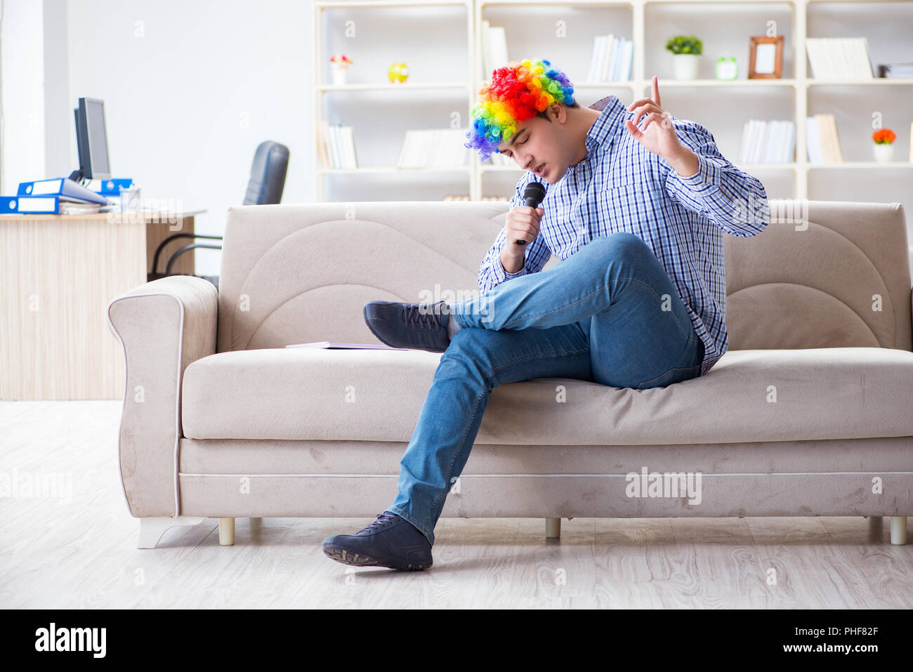 Funny man singing songs in karaoke at home Stock Photo - Alamy