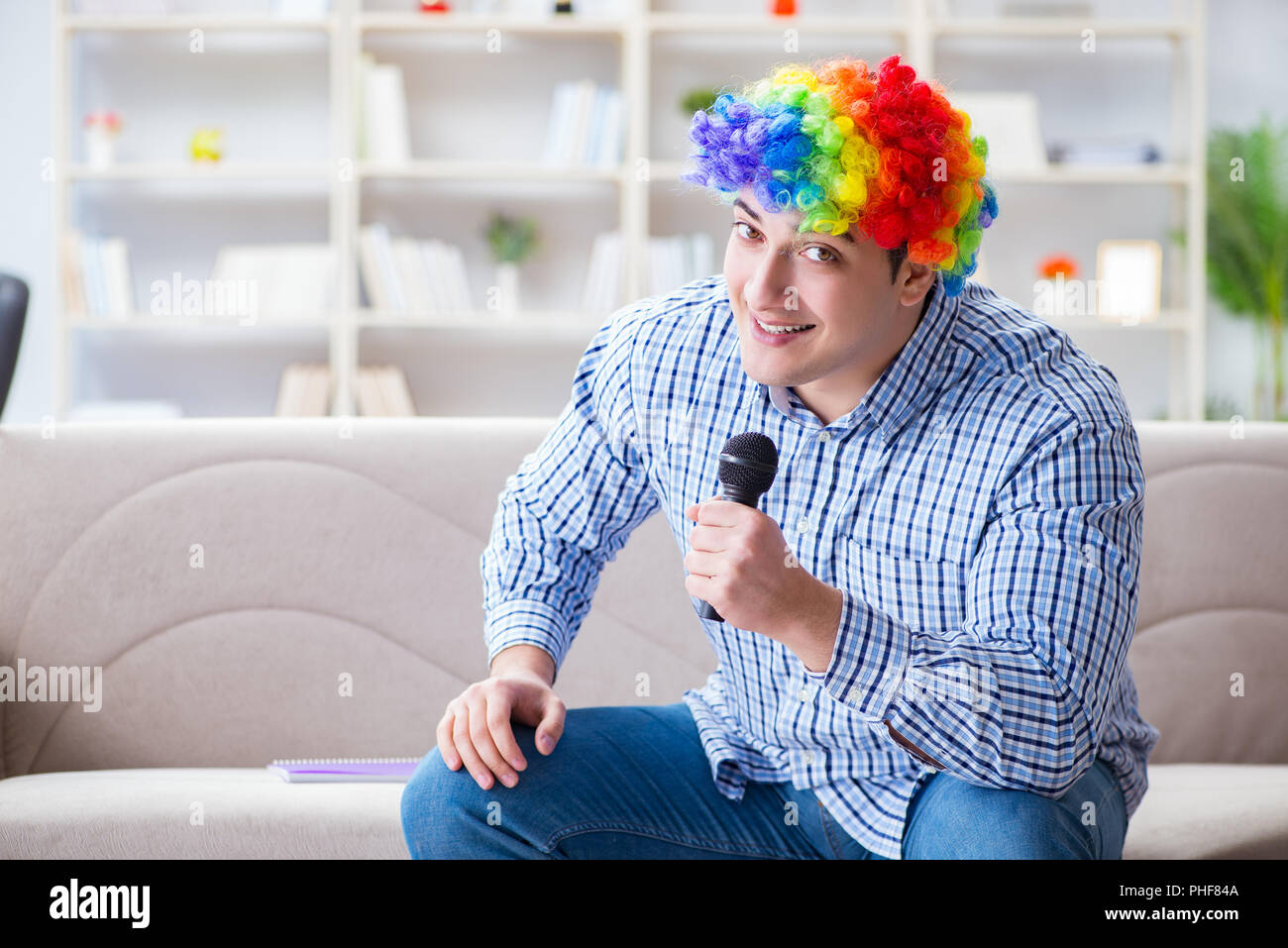 Funny man singing songs in karaoke at home Stock Photo - Alamy