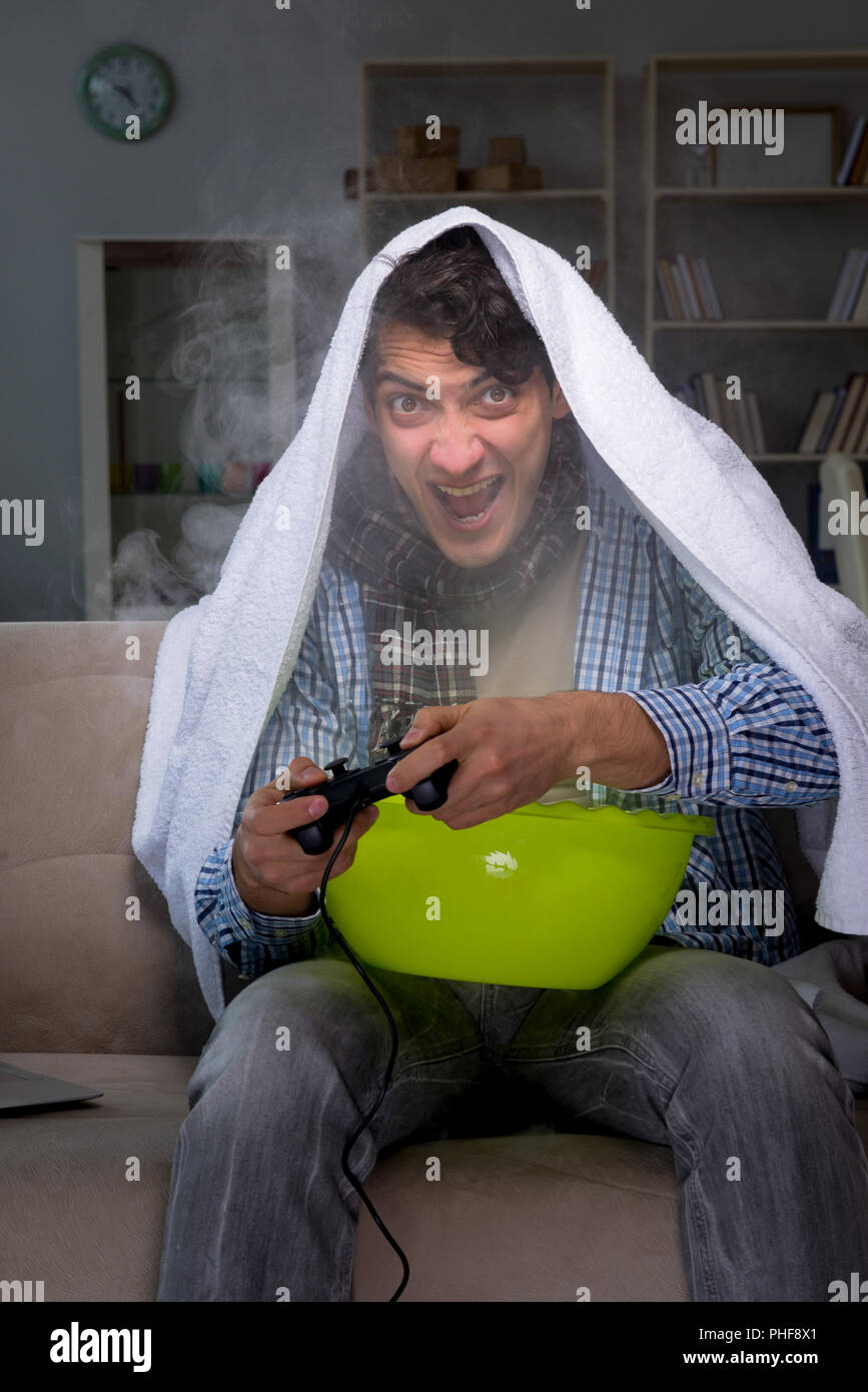 Sick man doing inhalation at night in home Stock Photo - Alamy