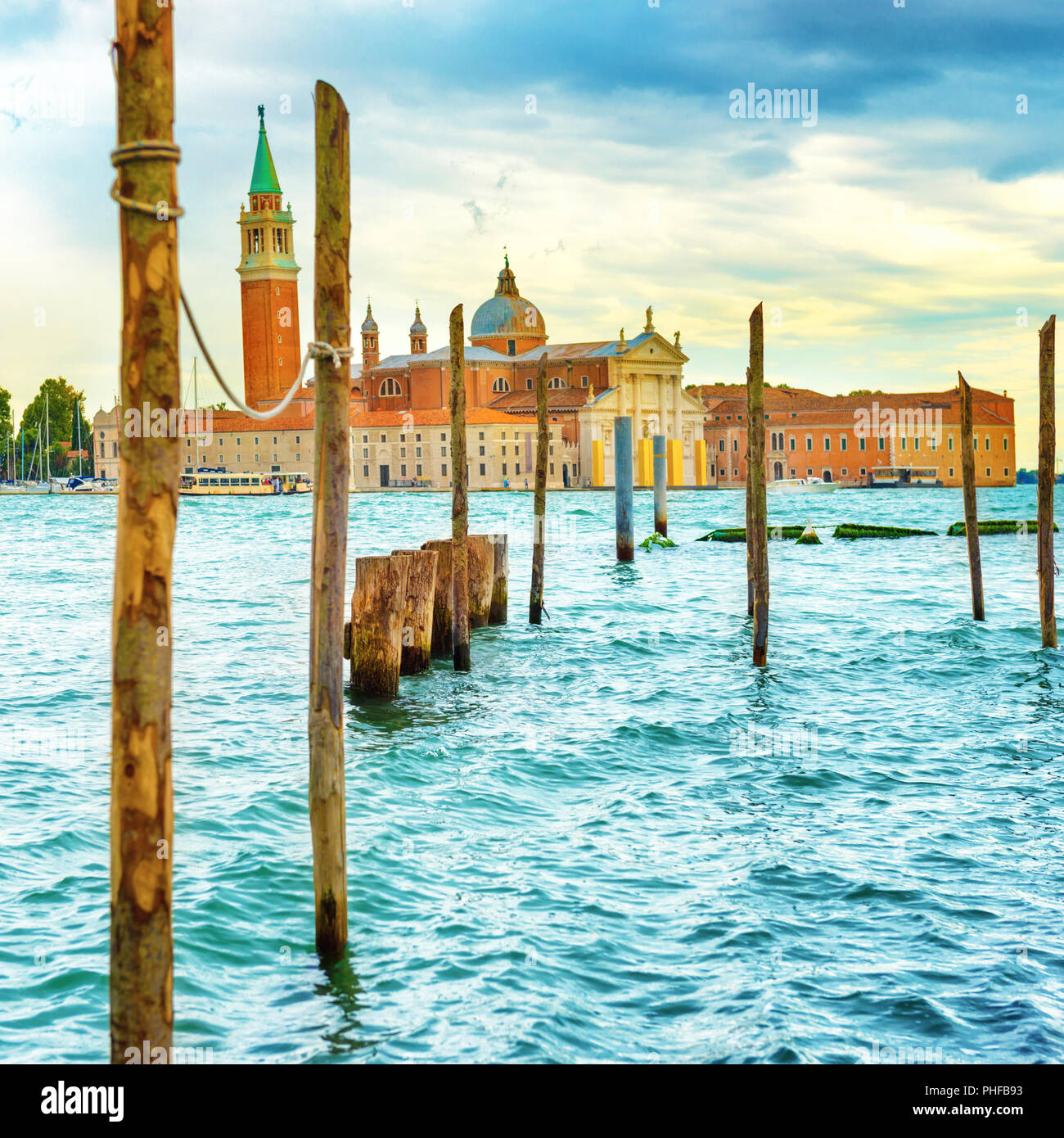 Moorage for gondolas with wooden poles Stock Photo - Alamy