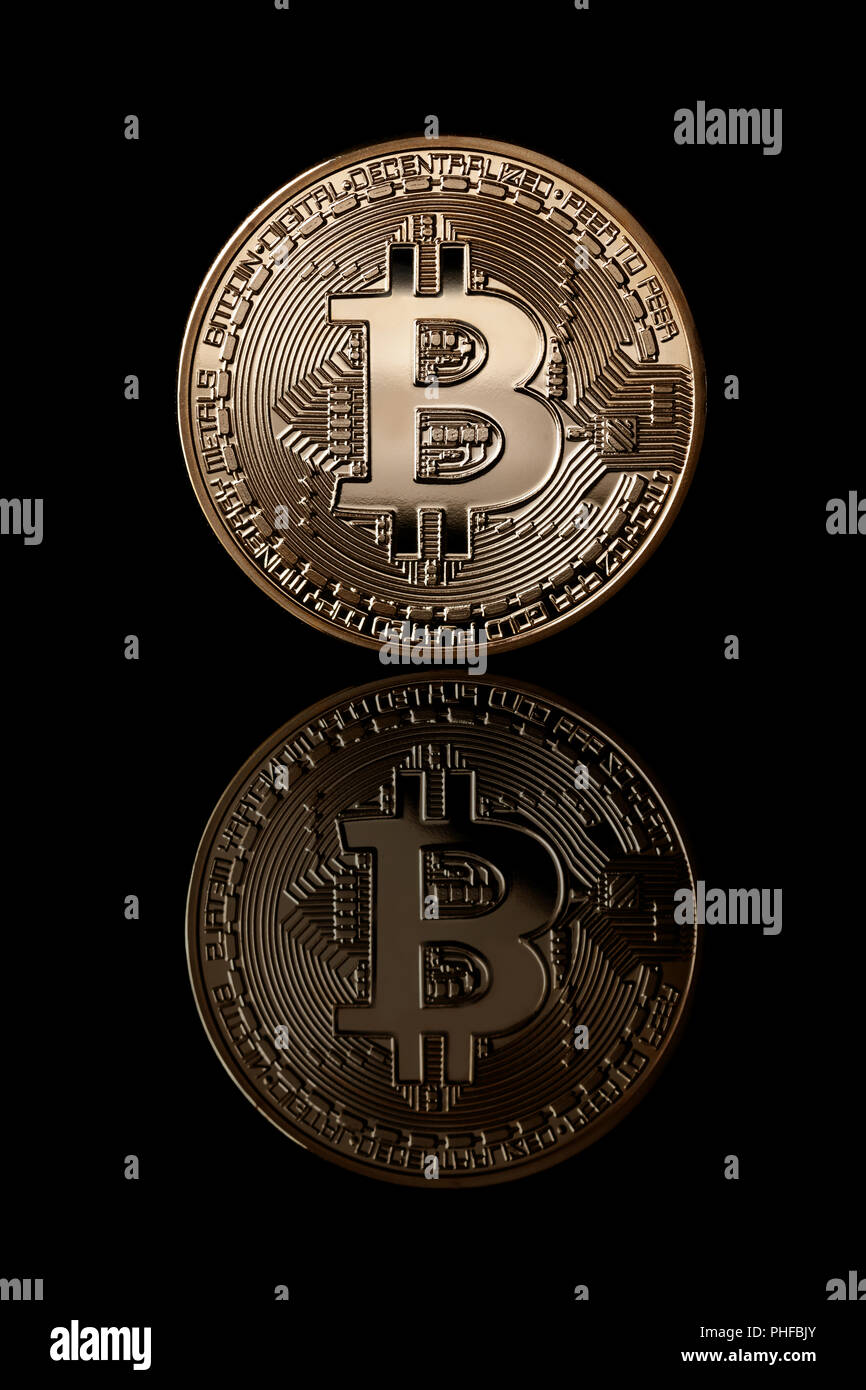 Bitcoin gold coin isolated on black background Stock Photo - Alamy