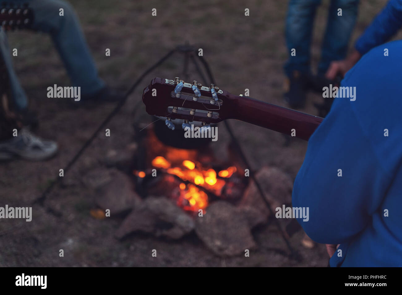 Guitar near the campfire Stock Photo - Alamy