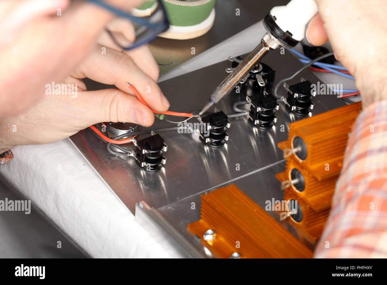 Man soldering computer component hi-res stock photography and images ...