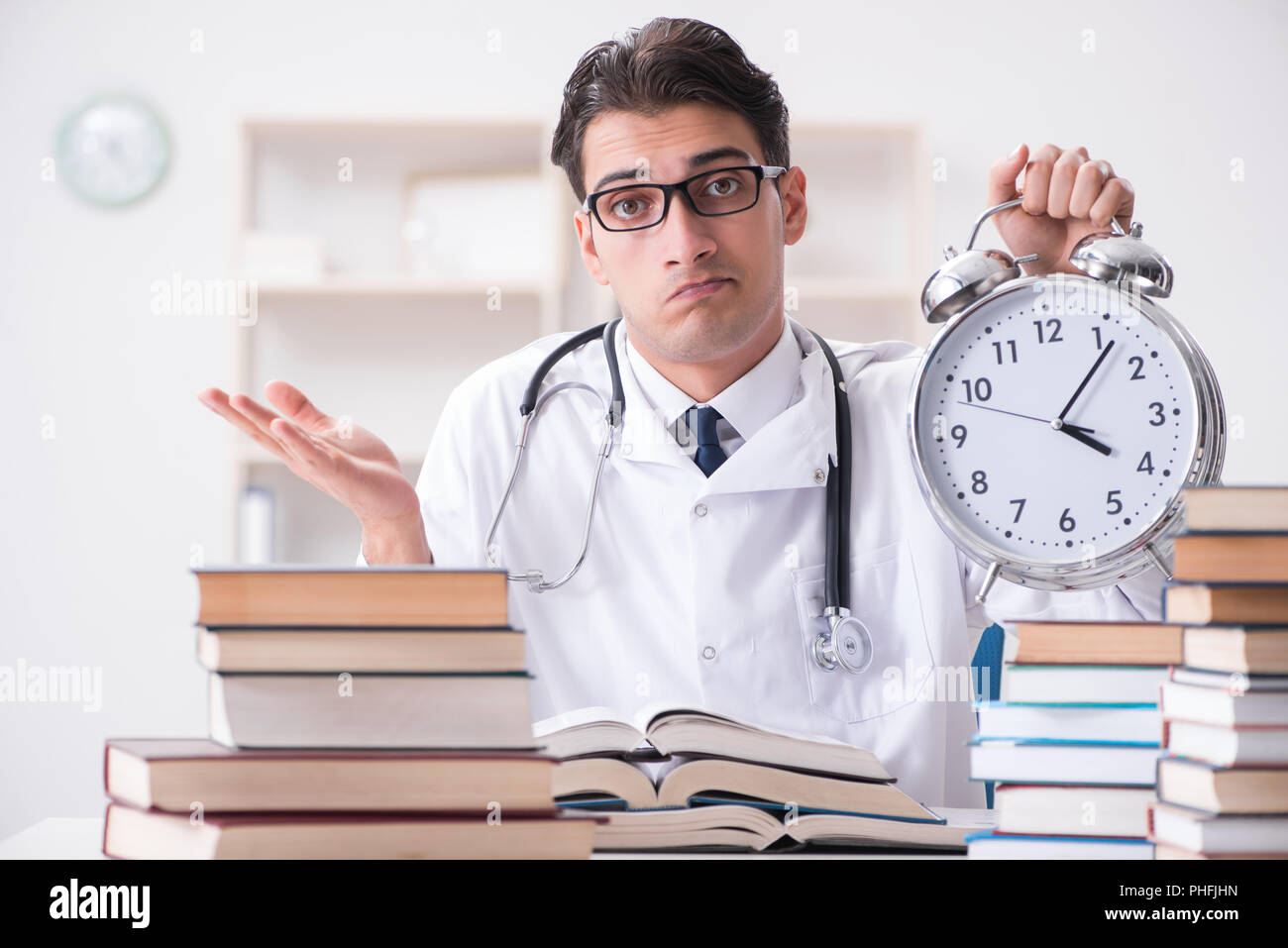 Medical student running out of time for exams Stock Photo - Alamy