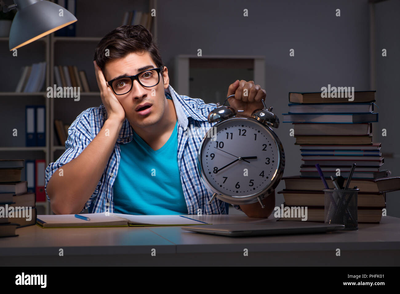 Student preparing for exams late night at home Stock Photo - Alamy