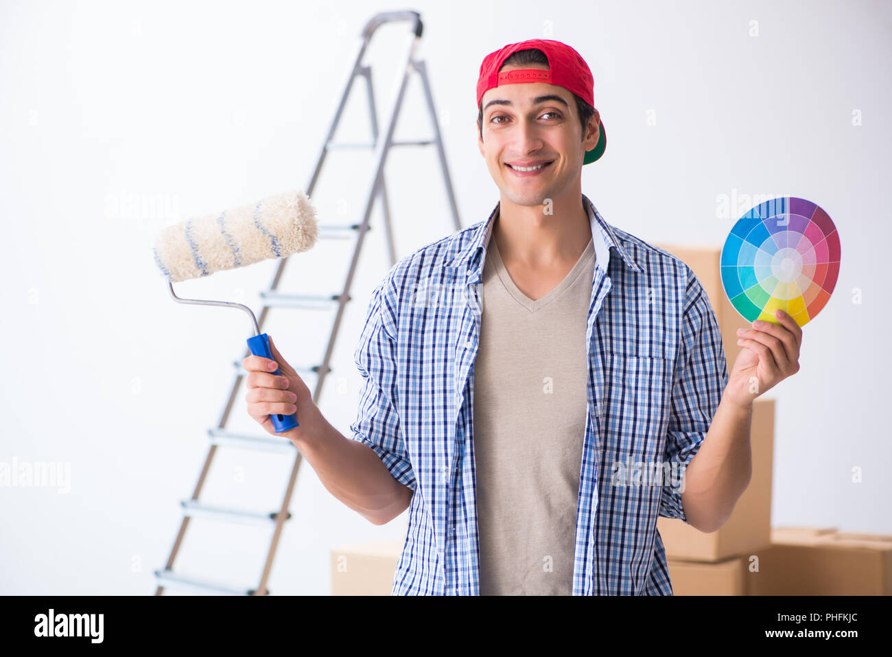 Young painter contractor choosing colors for home renovation Stock ...