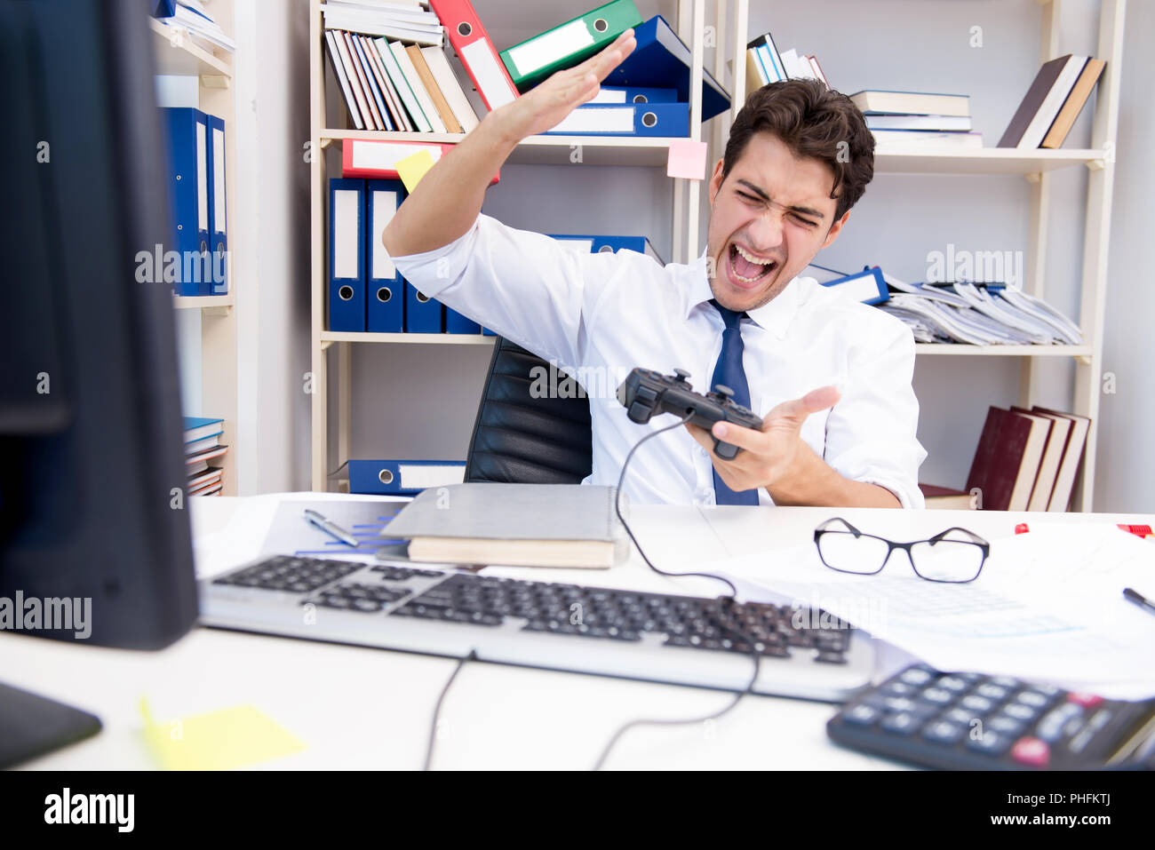 Employee playing computer games in the office Stock Photo - Alamy