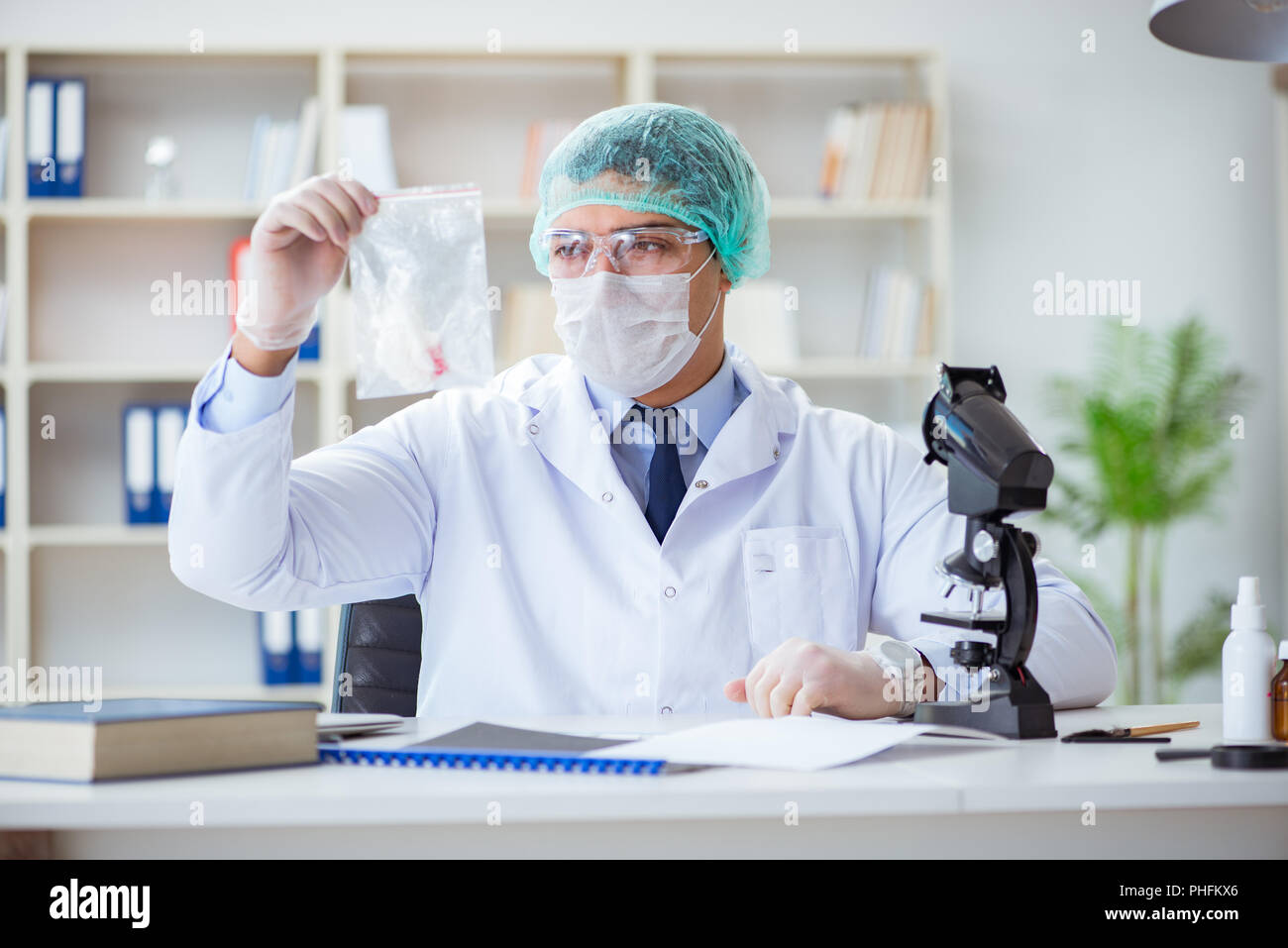 Forensic scientist analysing dna hi-res stock photography and images ...