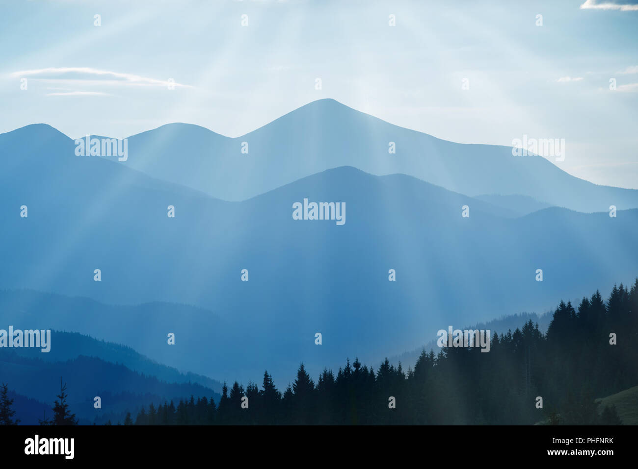 Blue mountains at sunset Stock Photo - Alamy