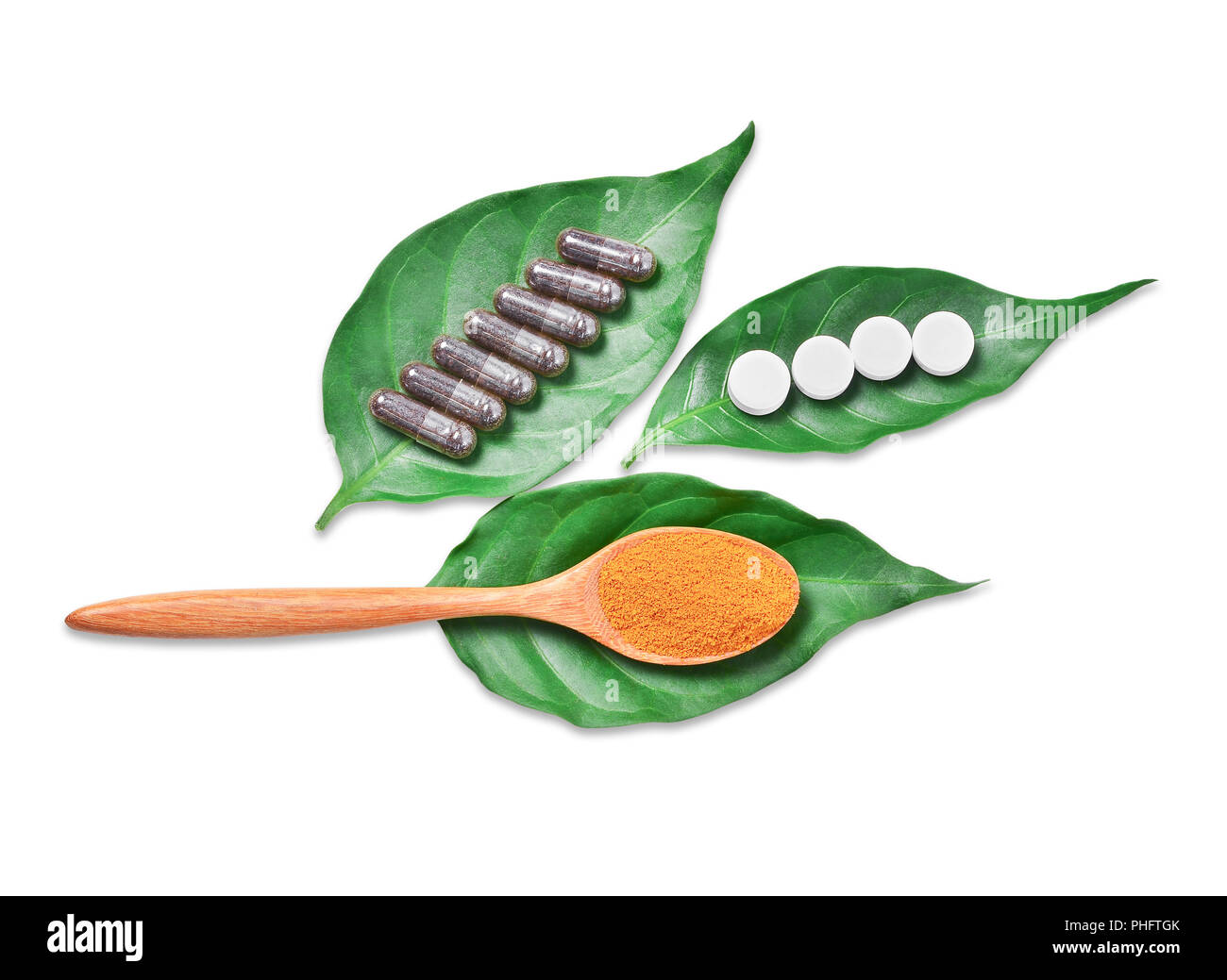 Powder medicine herb and capsule with white tab pills on green leaf ...