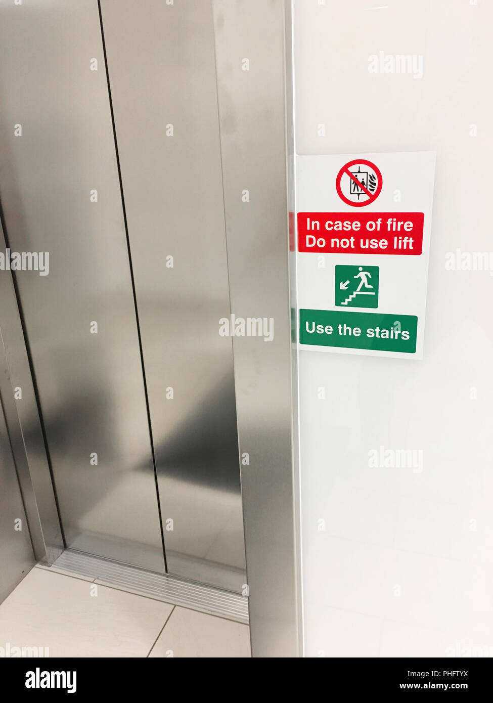 In case of fire do not use lift stairs to be used sign Stock Photo - Alamy