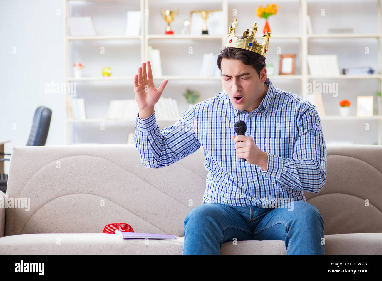 Funny man singing songs in karaoke at home Stock Photo - Alamy