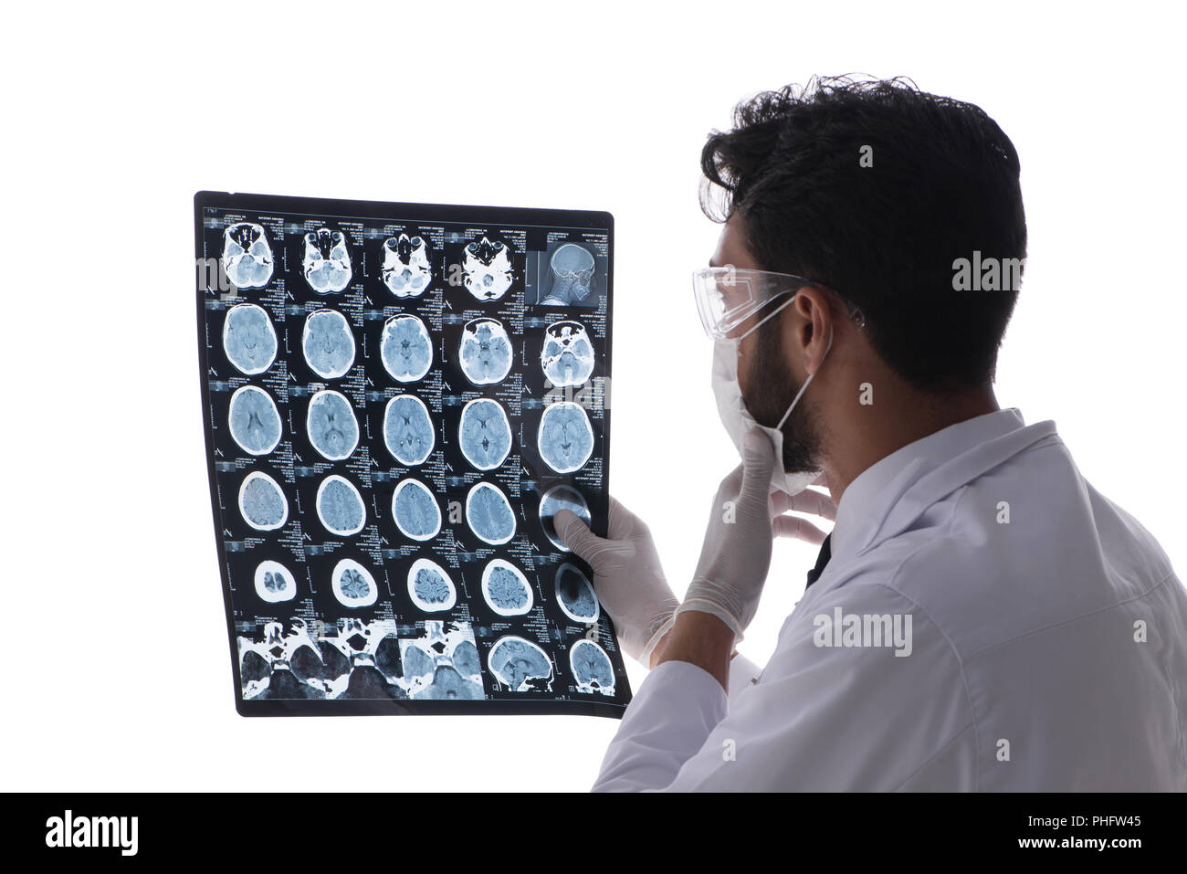 Young doctor looking at x-ray images isolated on white Stock Photo - Alamy