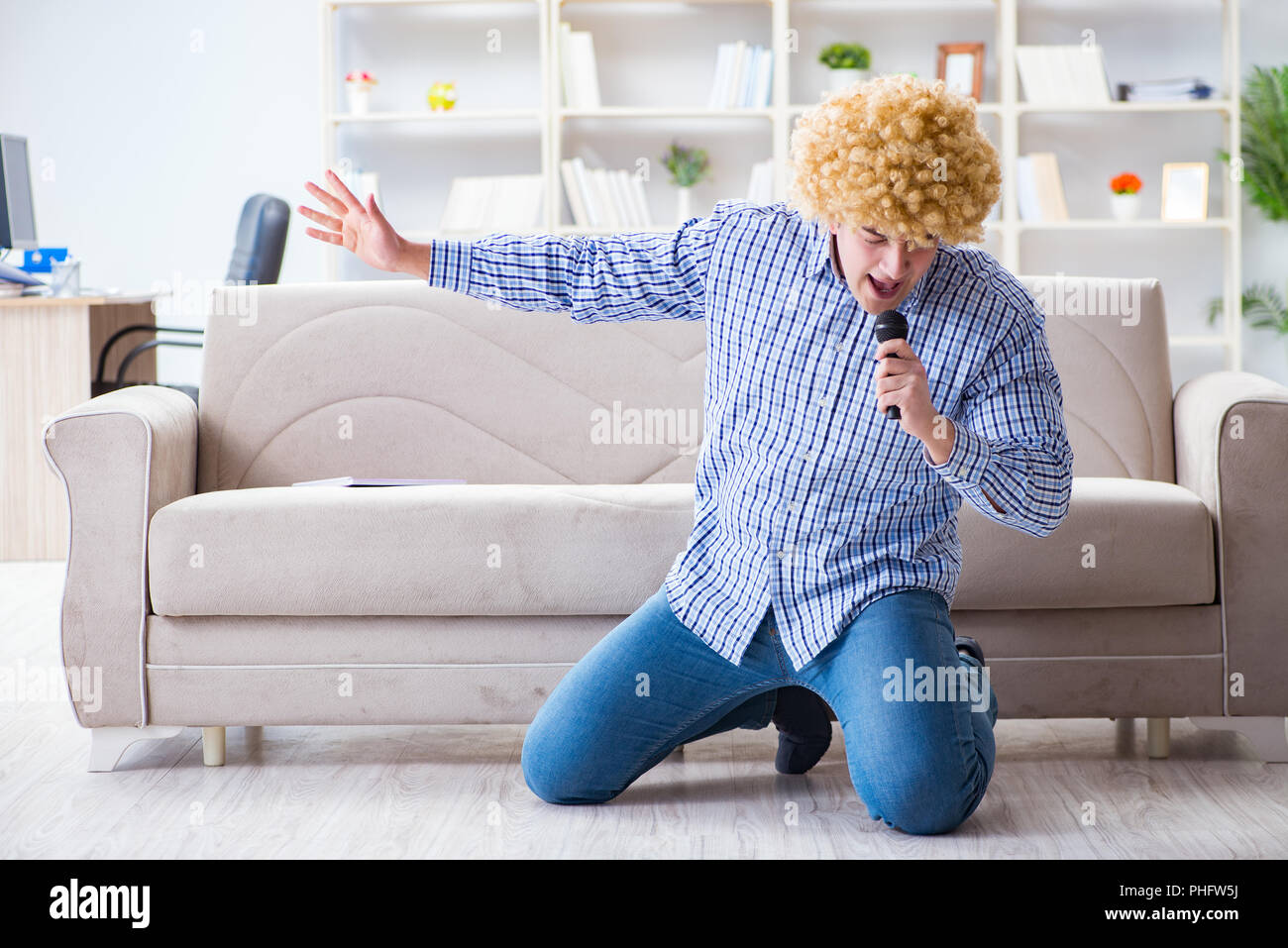 Funny man singing songs in karaoke at home Stock Photo - Alamy