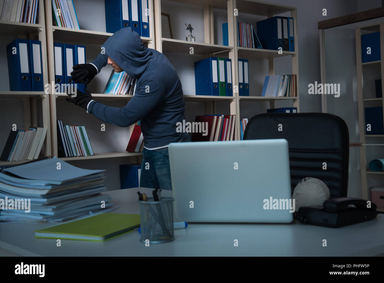 Young hacker hacking into computer at night Stock Photo - Alamy