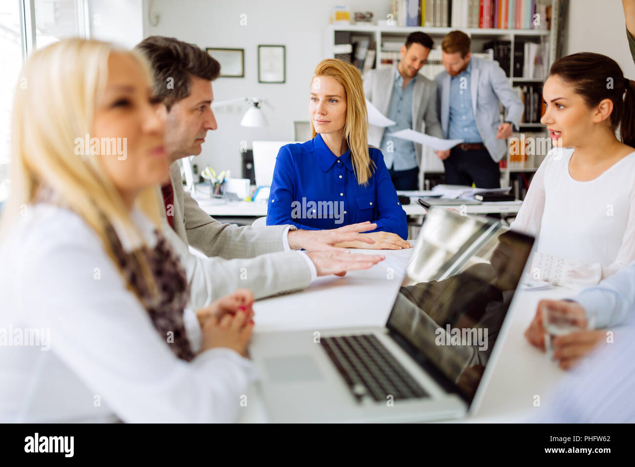 Diverse team collaborating in modern hi-res stock photography and ...
