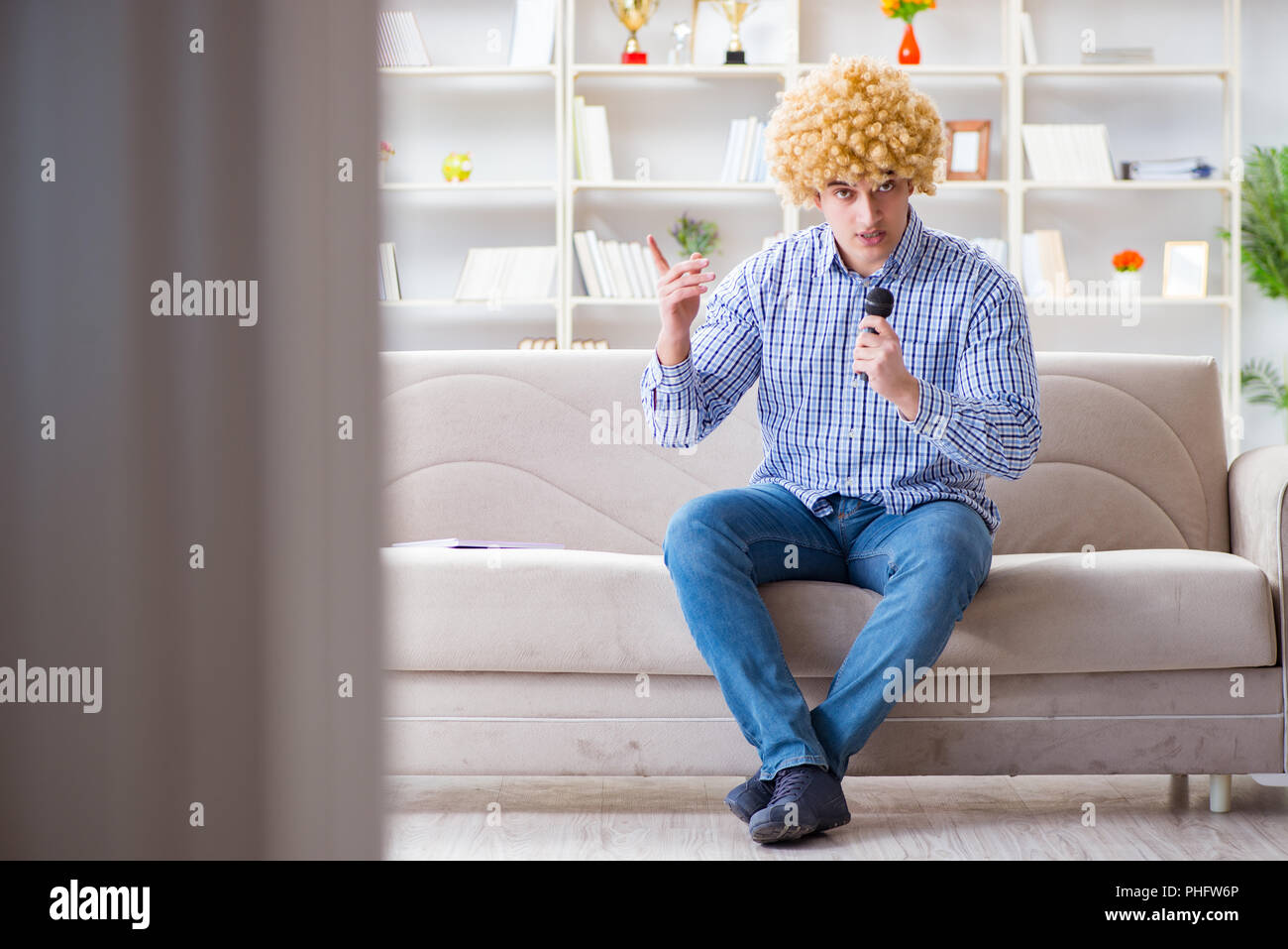 Funny man singing songs in karaoke at home Stock Photo - Alamy