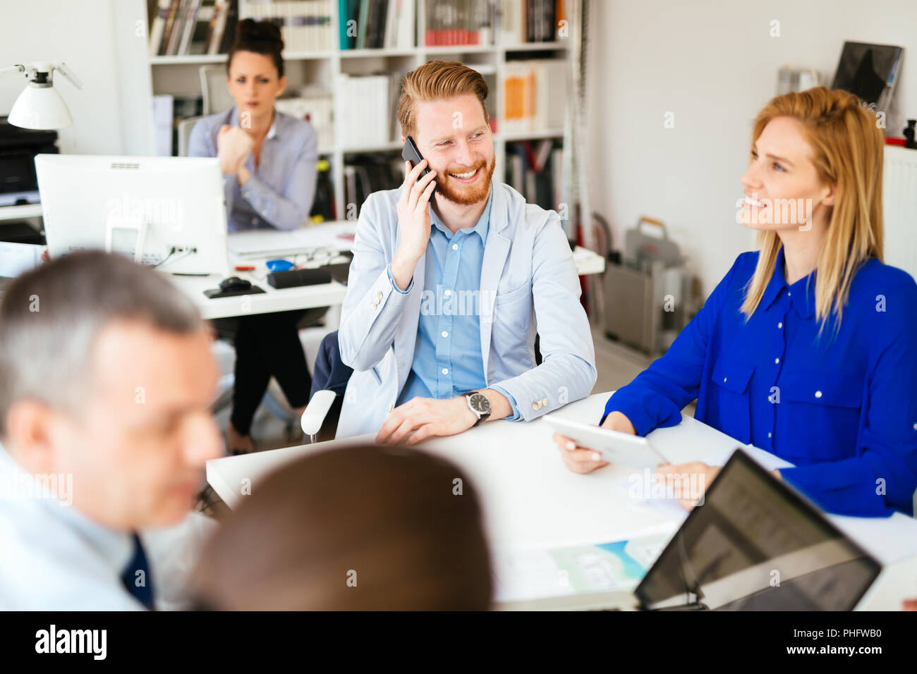 Two happy business people tablet hi-res stock photography and images - Alamy