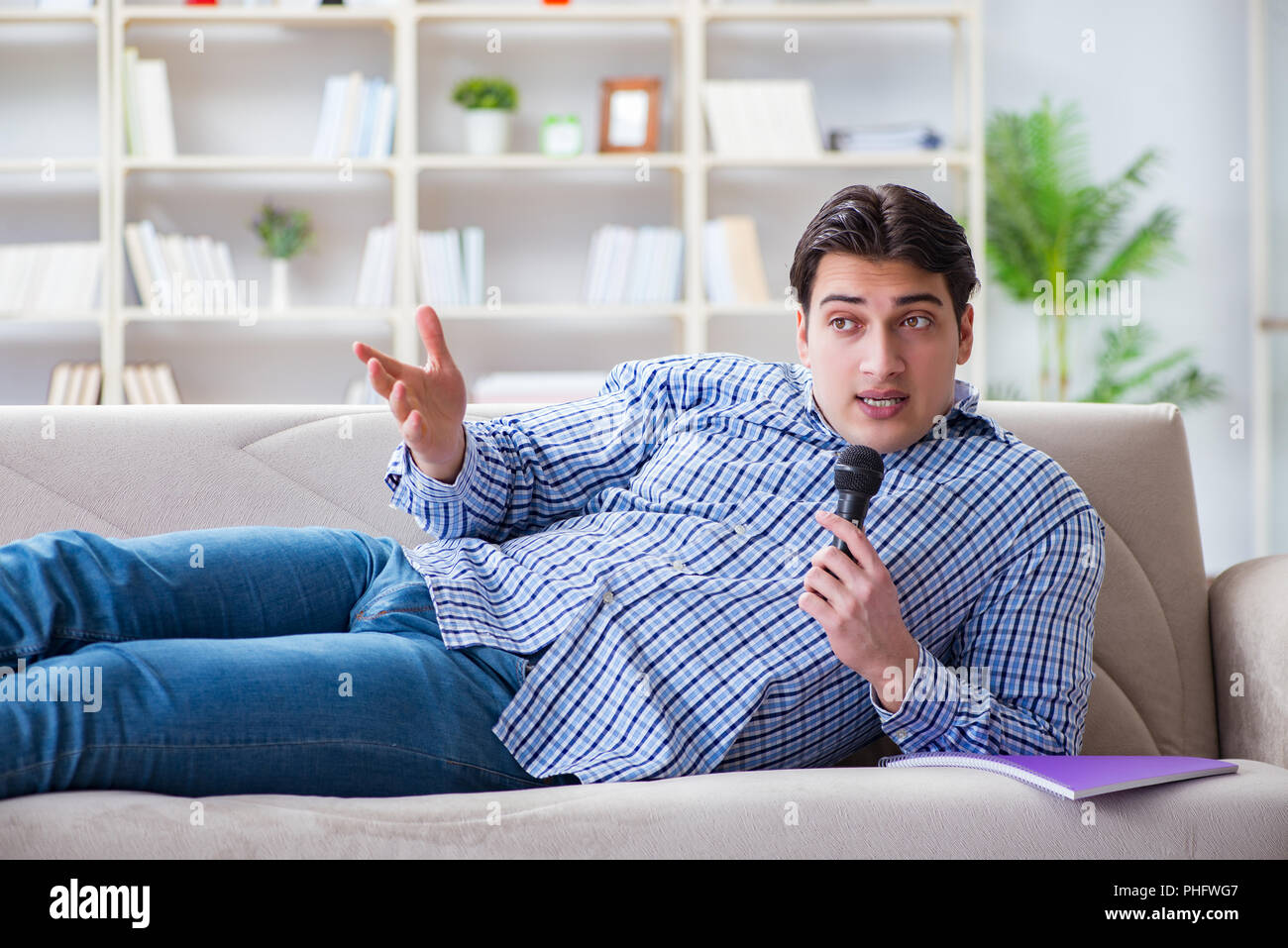 Funny man singing songs in karaoke at home Stock Photo - Alamy