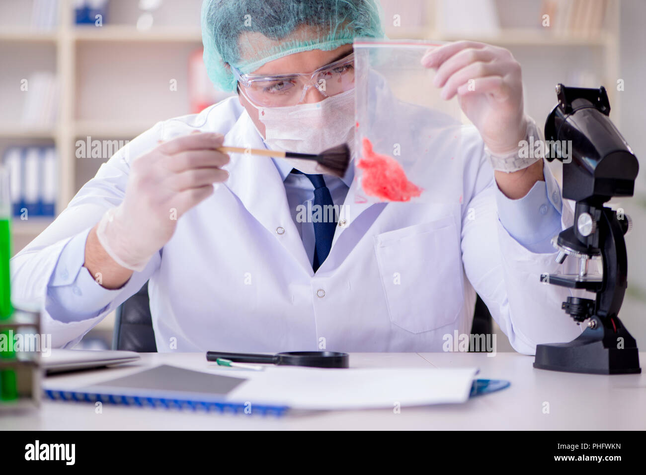 Forensics investigator working in lab on crime evidence Stock Photo - Alamy