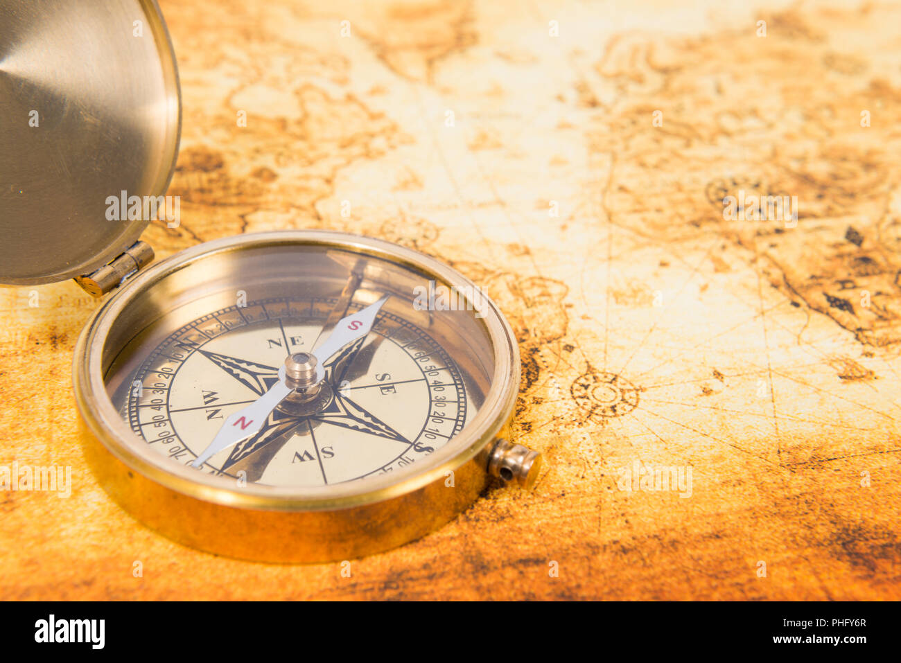 Old map with an ancient compass Stock Photo - Alamy