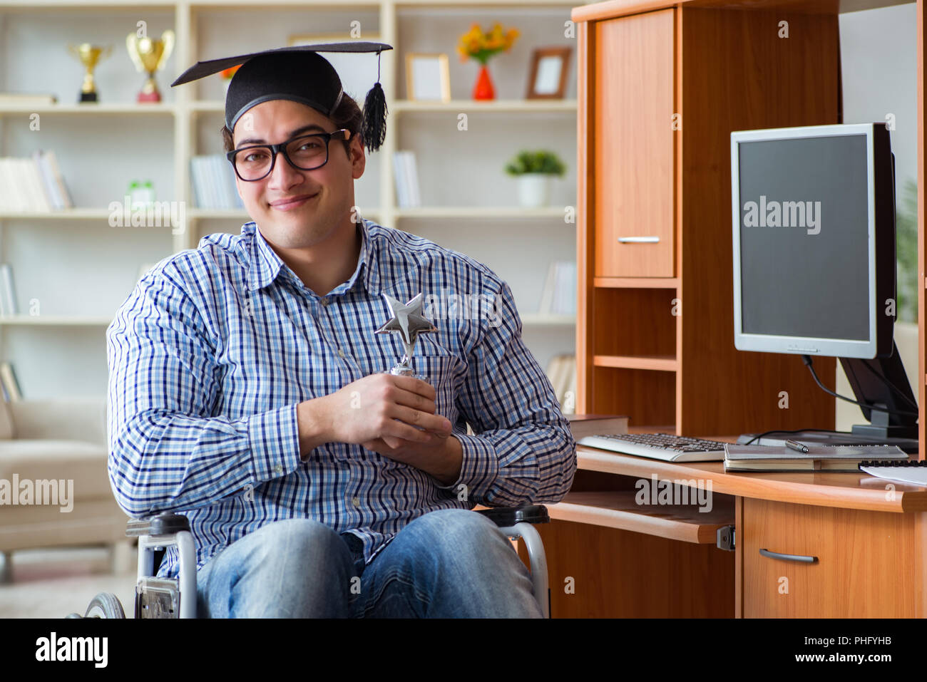 Disabled student studying at home on wheelchair Stock Photo - Alamy