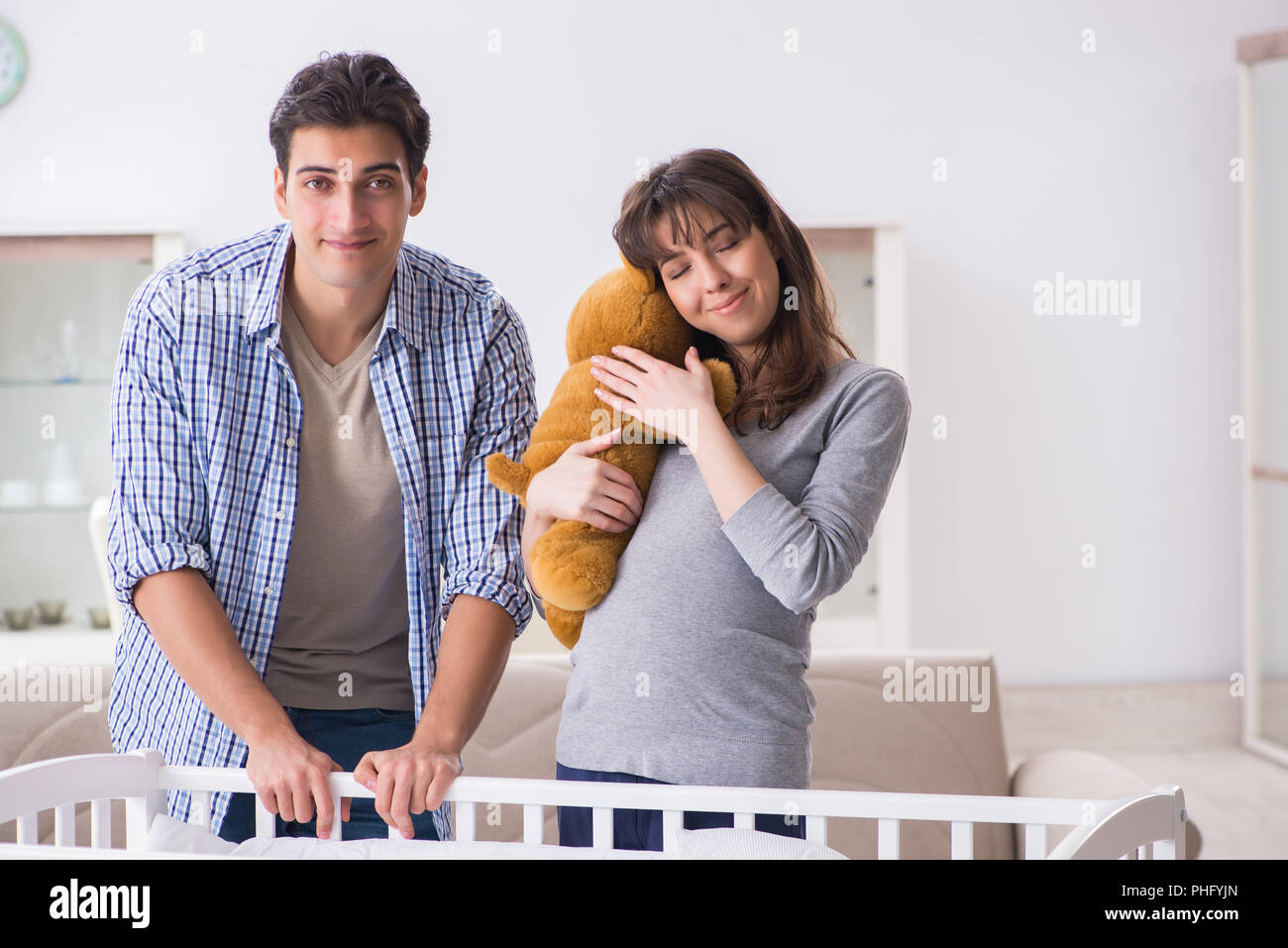 Young parents expecting their first baby Stock Photo - Alamy