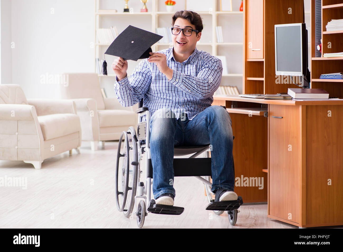 Disabled student studying at home on wheelchair Stock Photo - Alamy