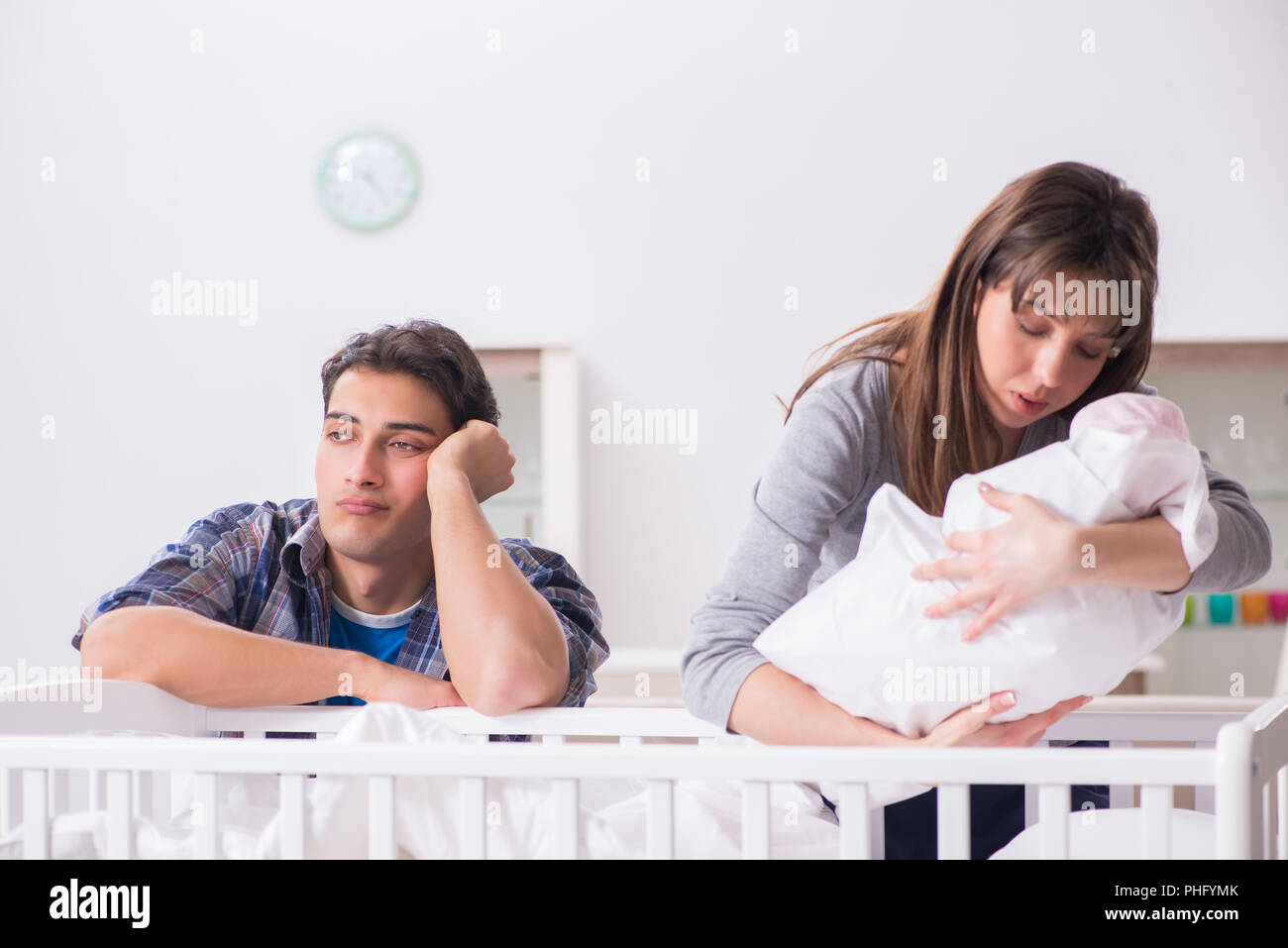 Young dad cannot stand baby crying Stock Photo - Alamy