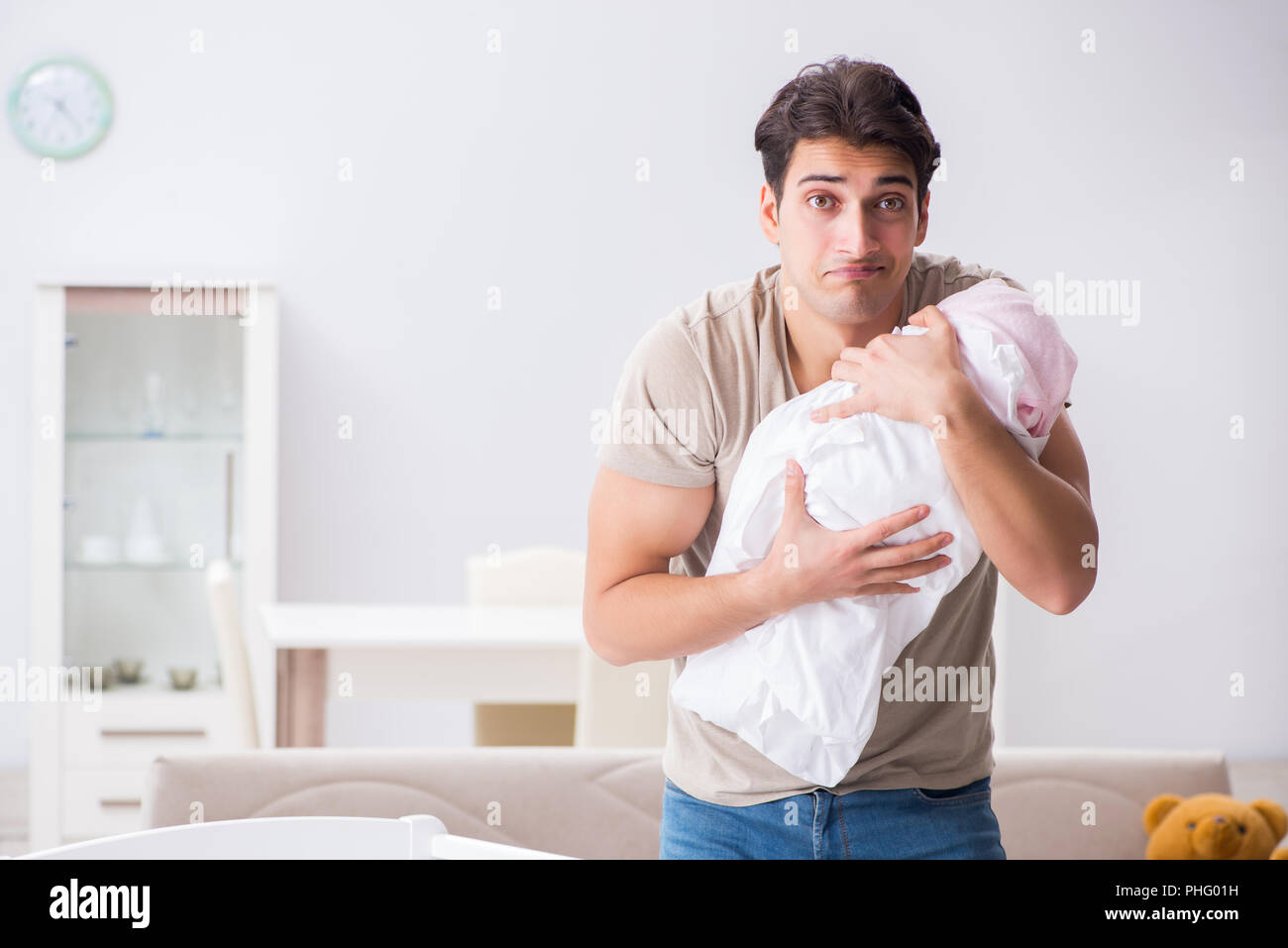 Young father dad frustrated at crying baby Stock Photo - Alamy