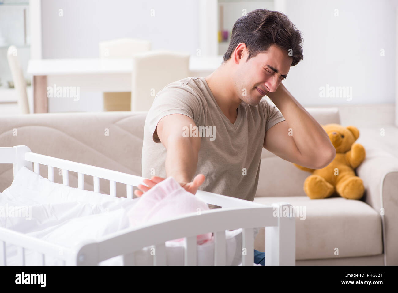 Young father dad frustrated at crying baby Stock Photo - Alamy