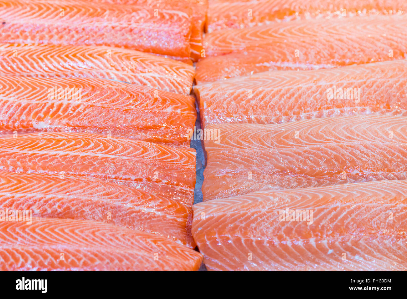 Salmon Fillet in Ice on the supermarket counter. Fillet of red fish in ...