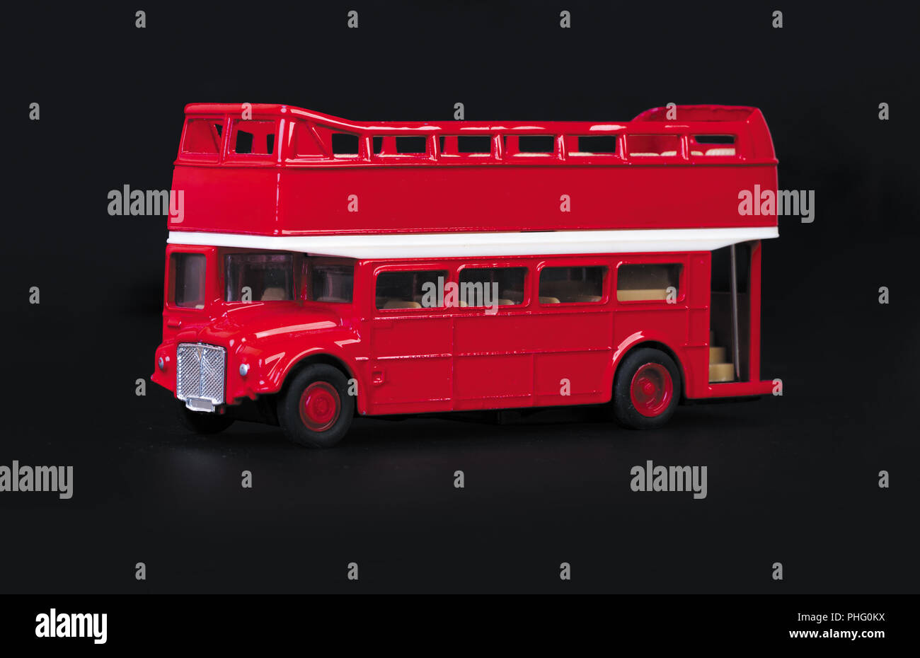 London bus toy isolated on black background Stock Photo - Alamy
