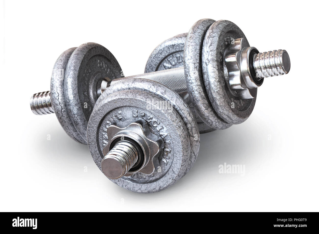 Heavy metal dumbbells on a white background Stock Photo - Alamy
